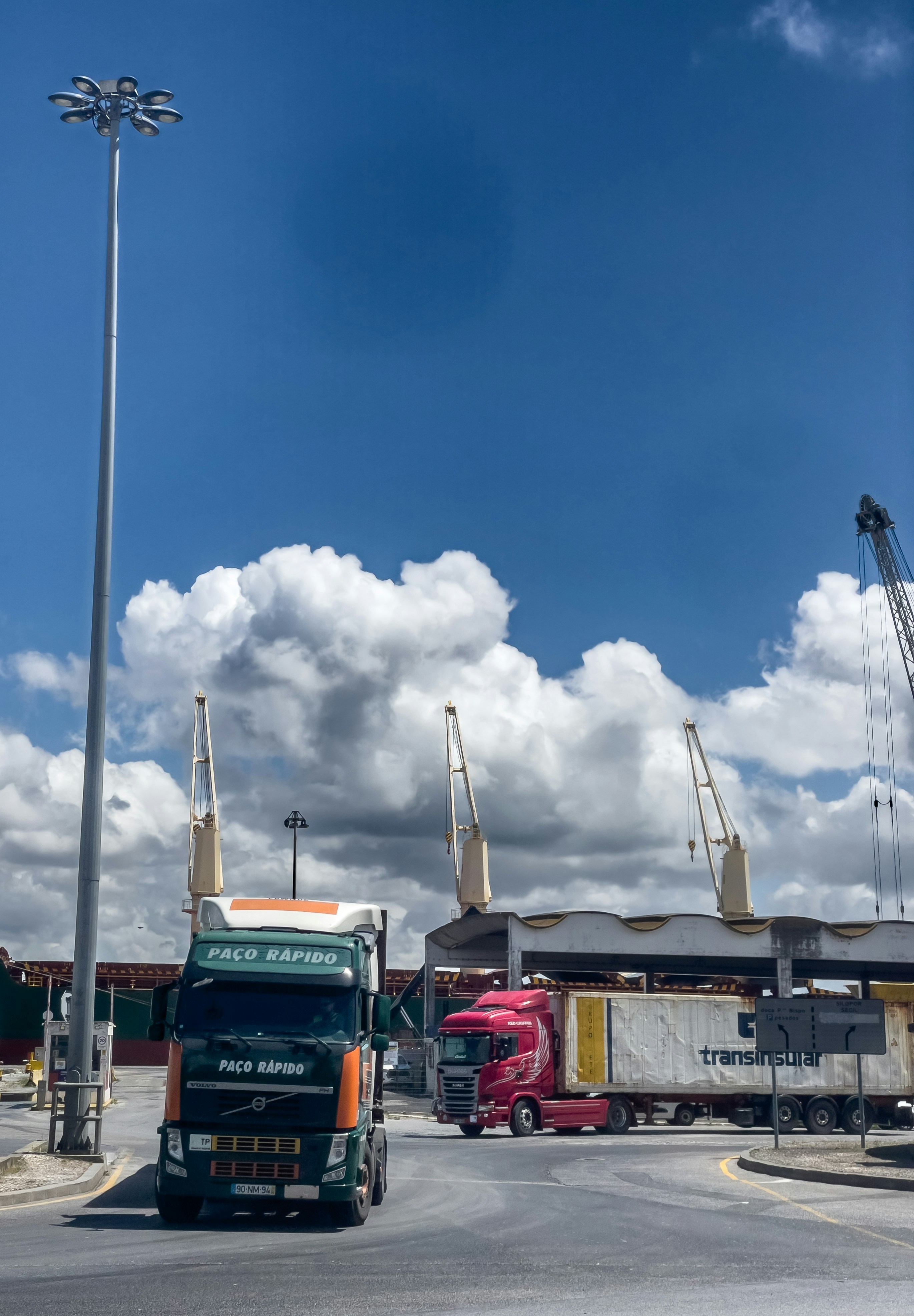 Dockside Freight Under a Cresting Sky