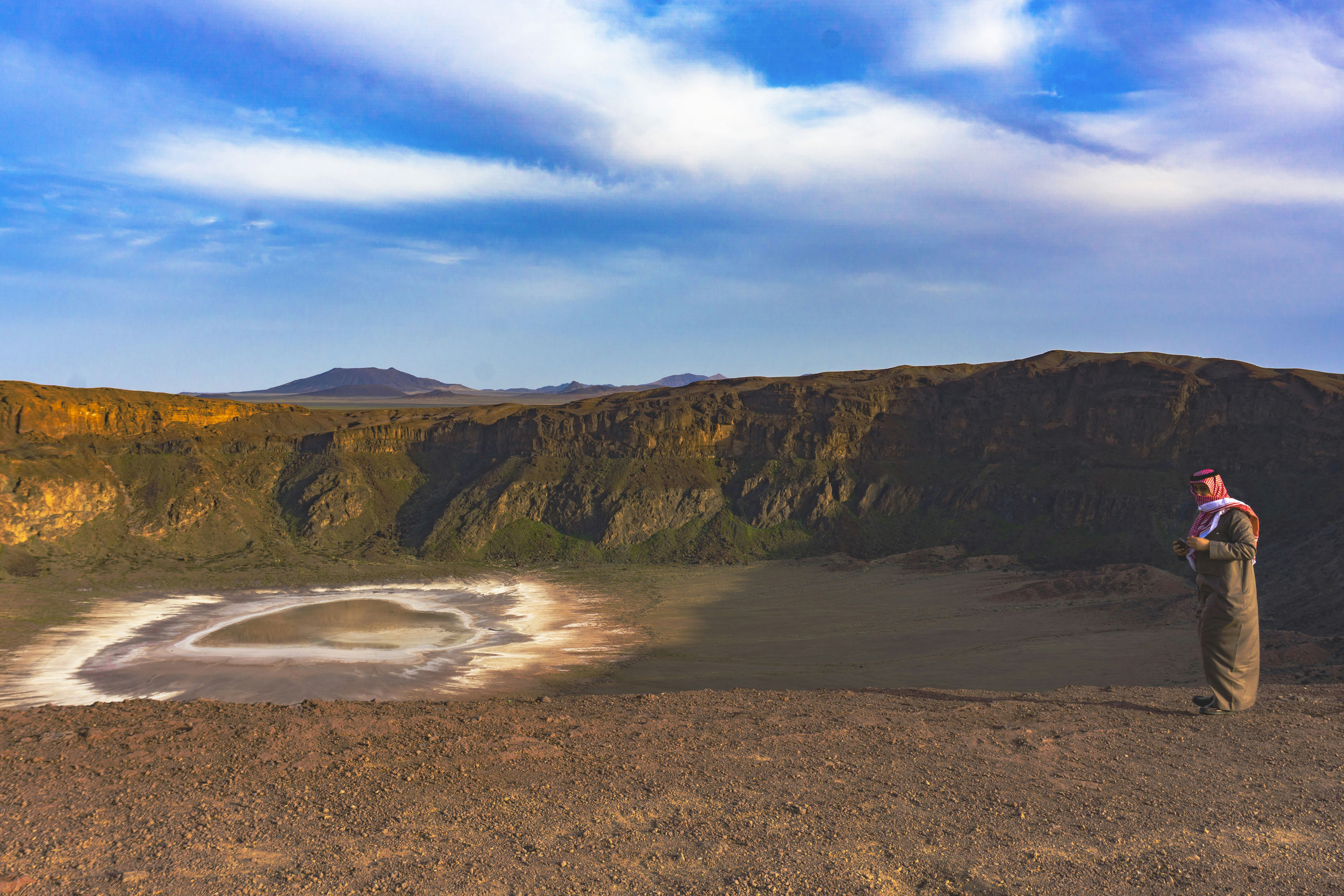 Desert Caldera at Dusk with Lone Photographer