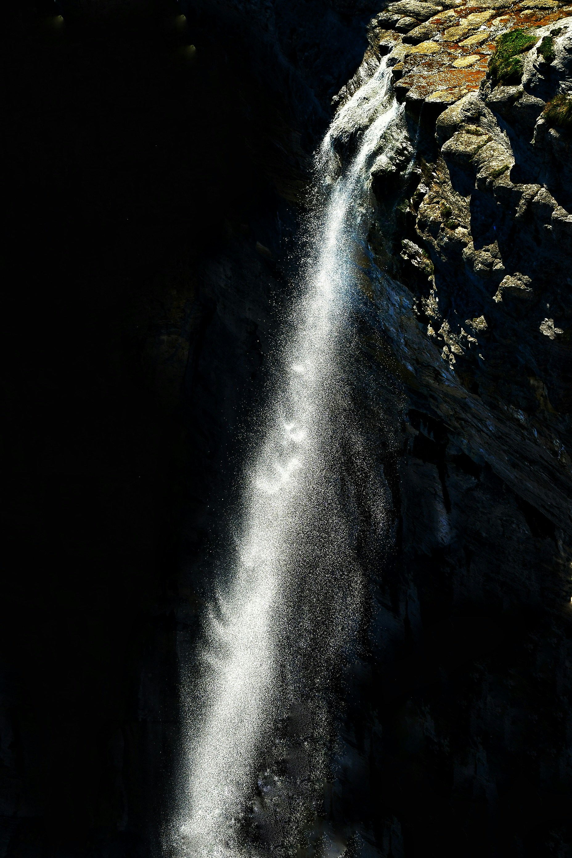 Crescent Cascade: Narrow Ribbon of Light on a Cliff Edge