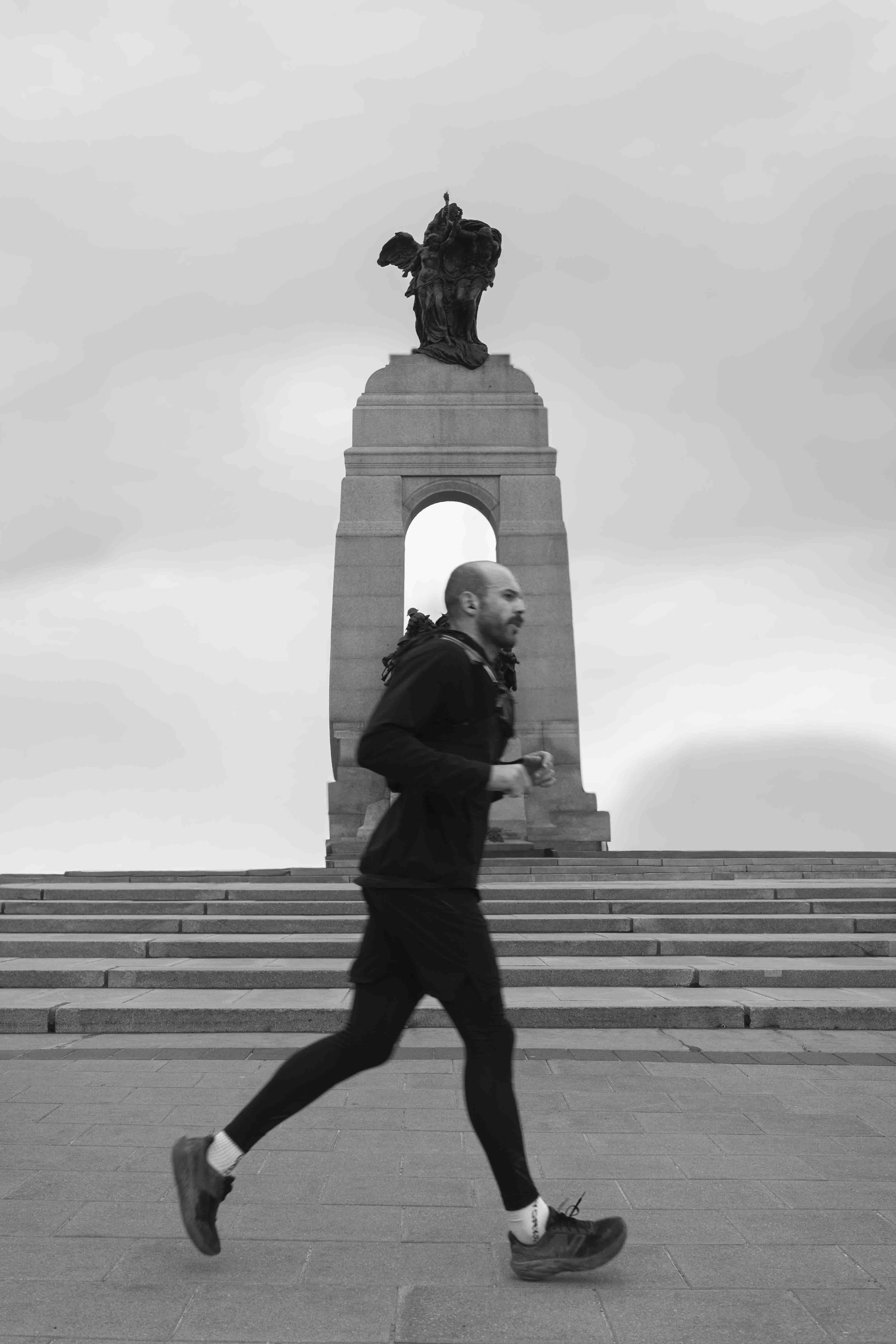 Runner in Motion Before the Monument