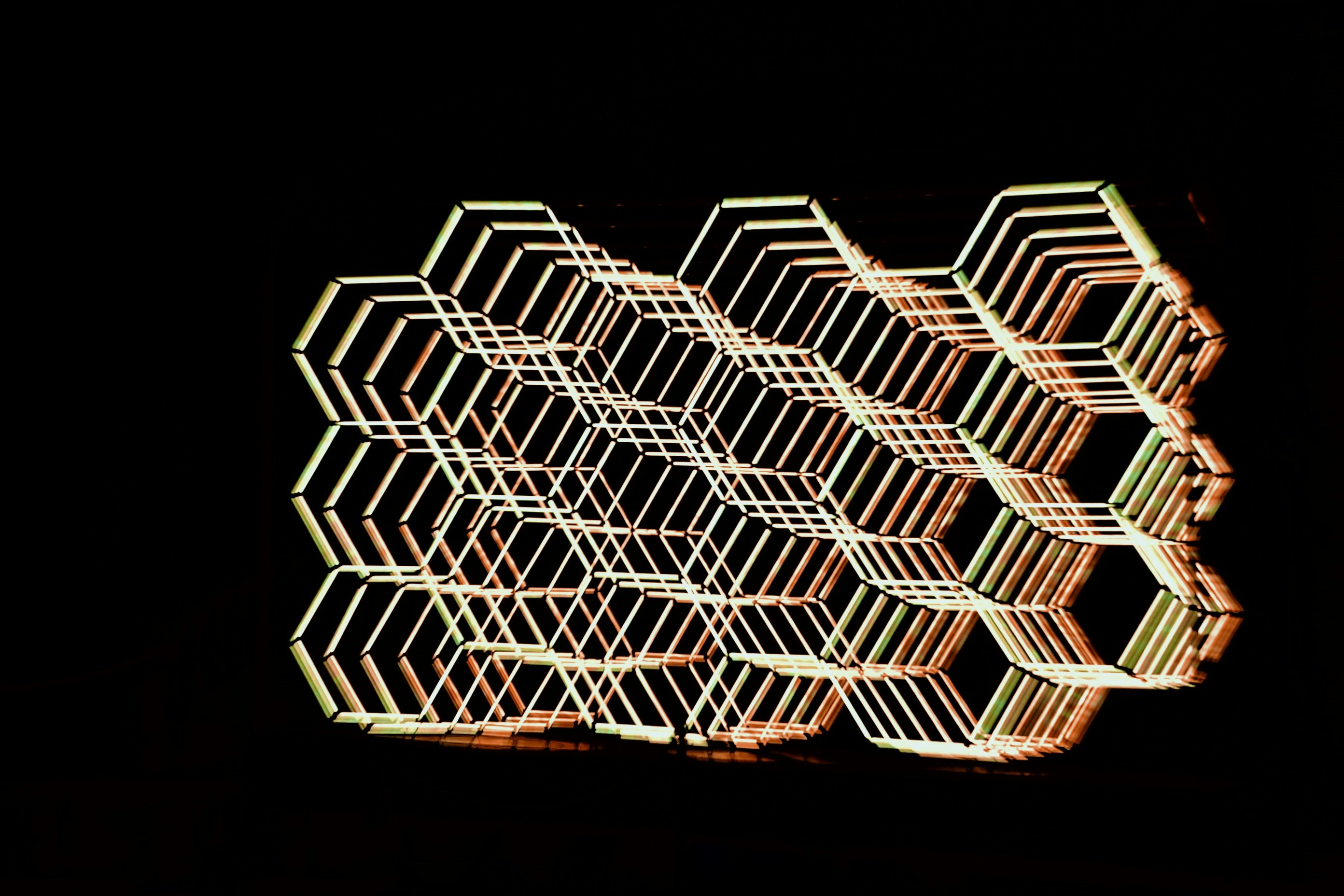 Hexagonal Echoes: Neon Mesh of Refracted Light