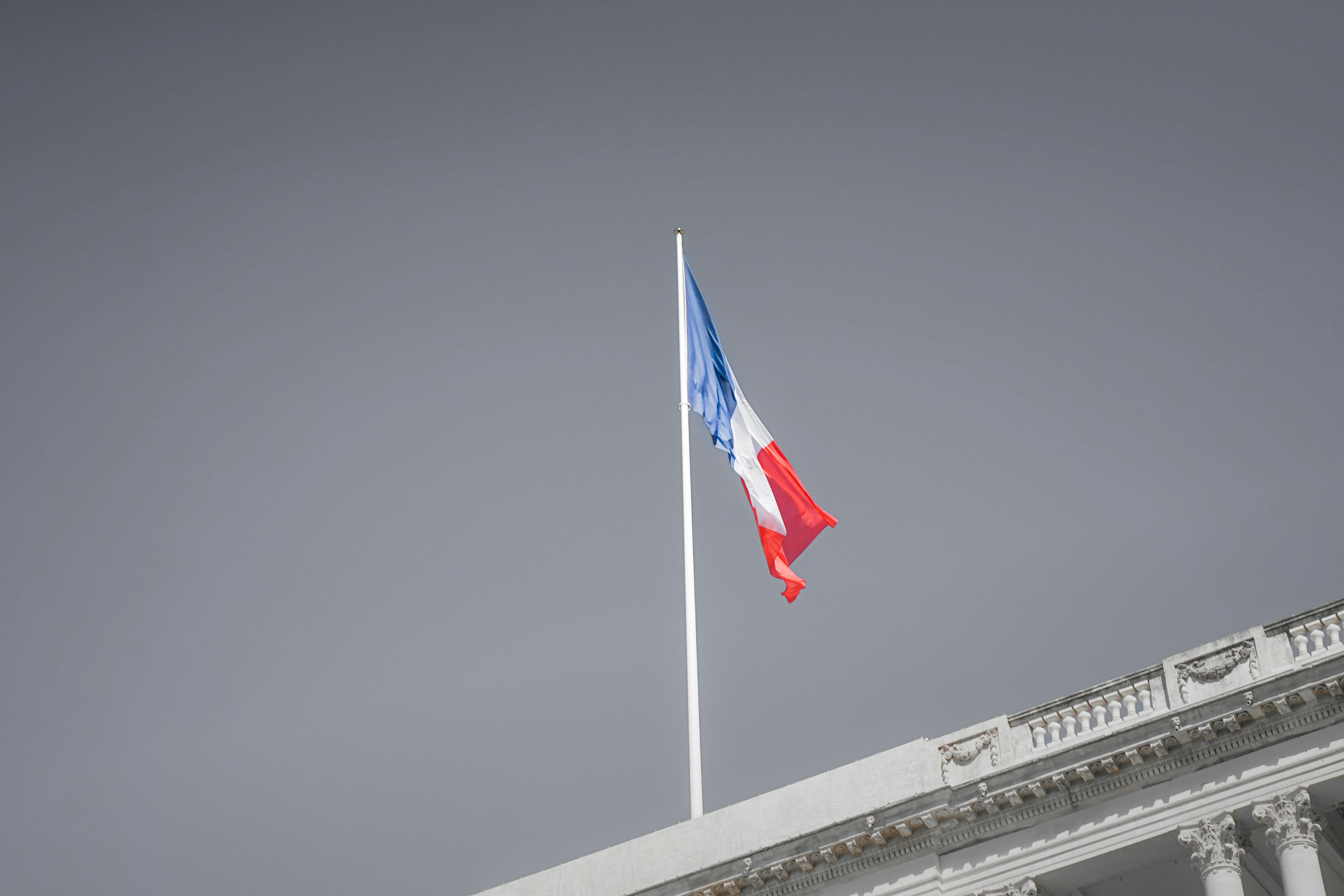 Flag on the Crest: A lone tricolor atop a monumental façade