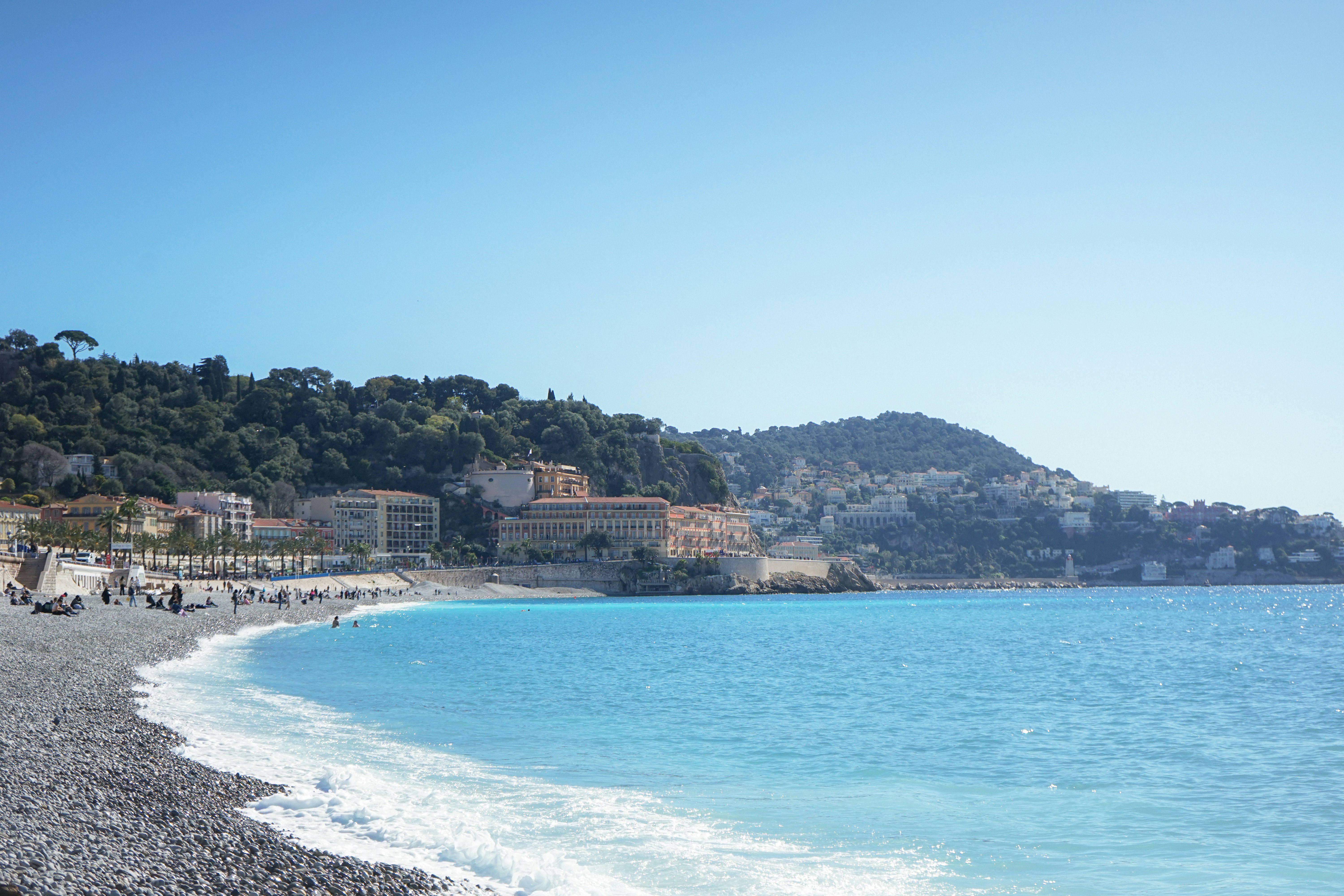 Coastal Village Inspires Calm: A Sunlit Mediterranean Beach