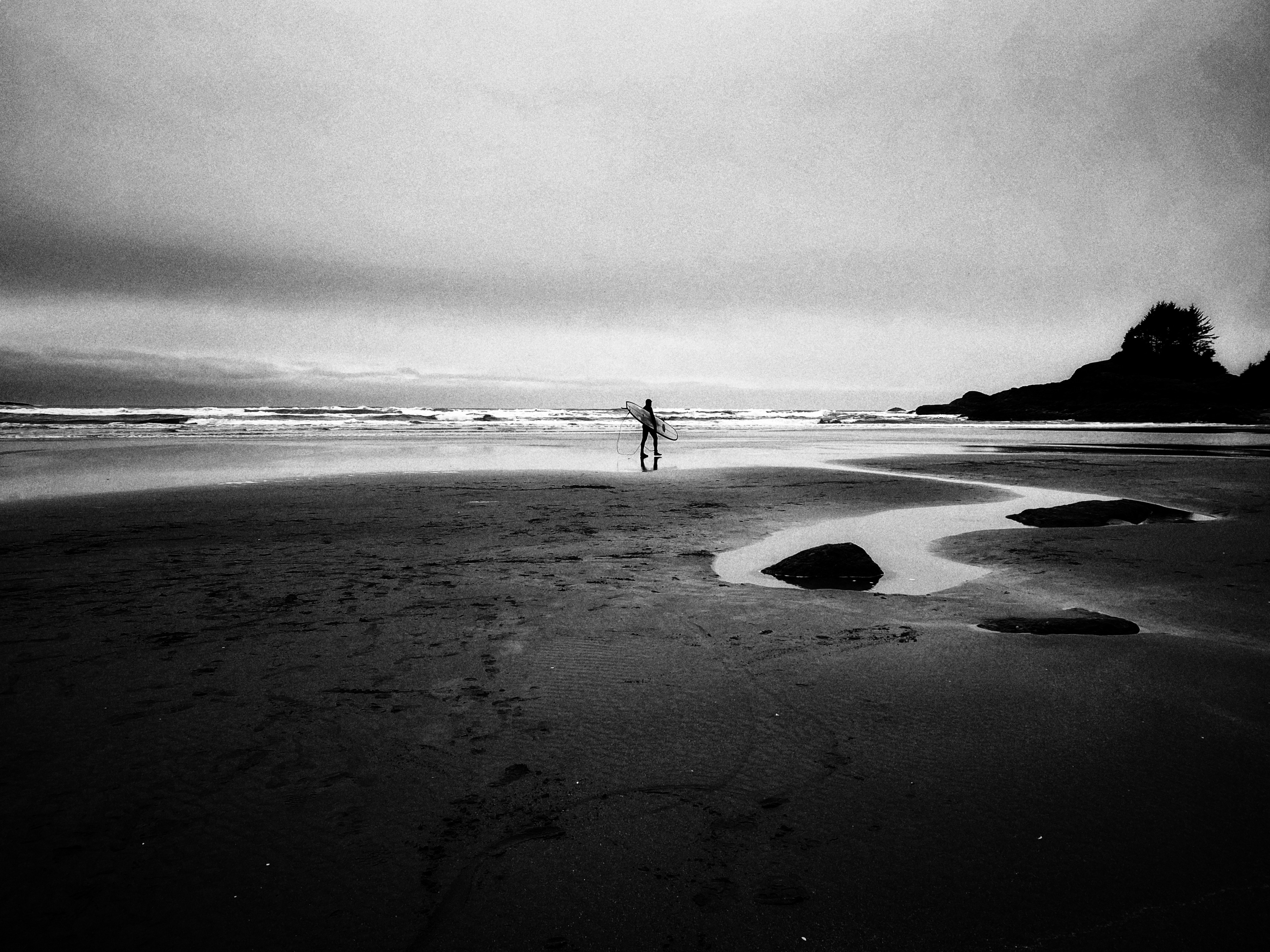  solitary figure at the shore under a stormy sky 