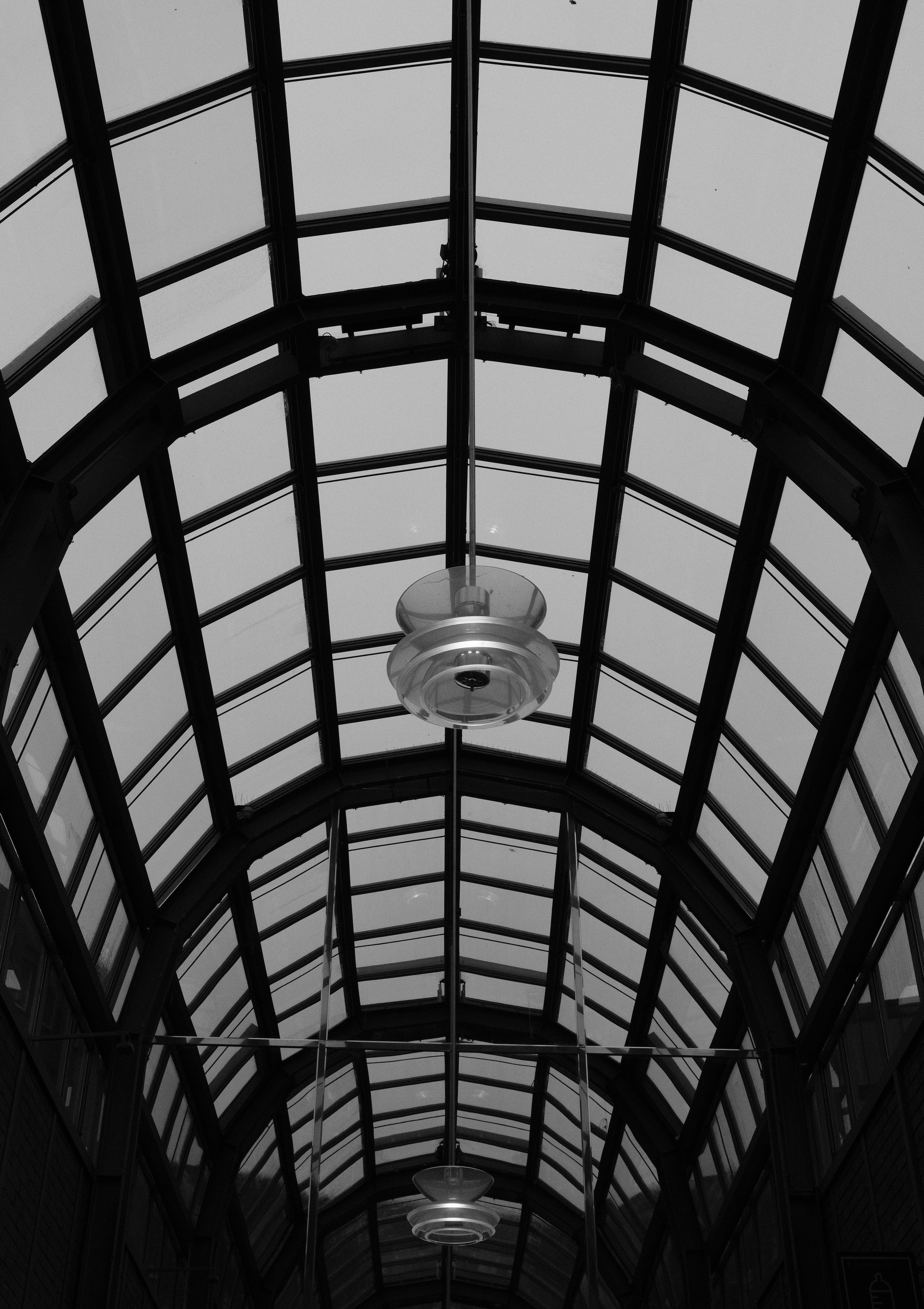 Symmetry under Glass: A Converging Corridor of Arched Skylights