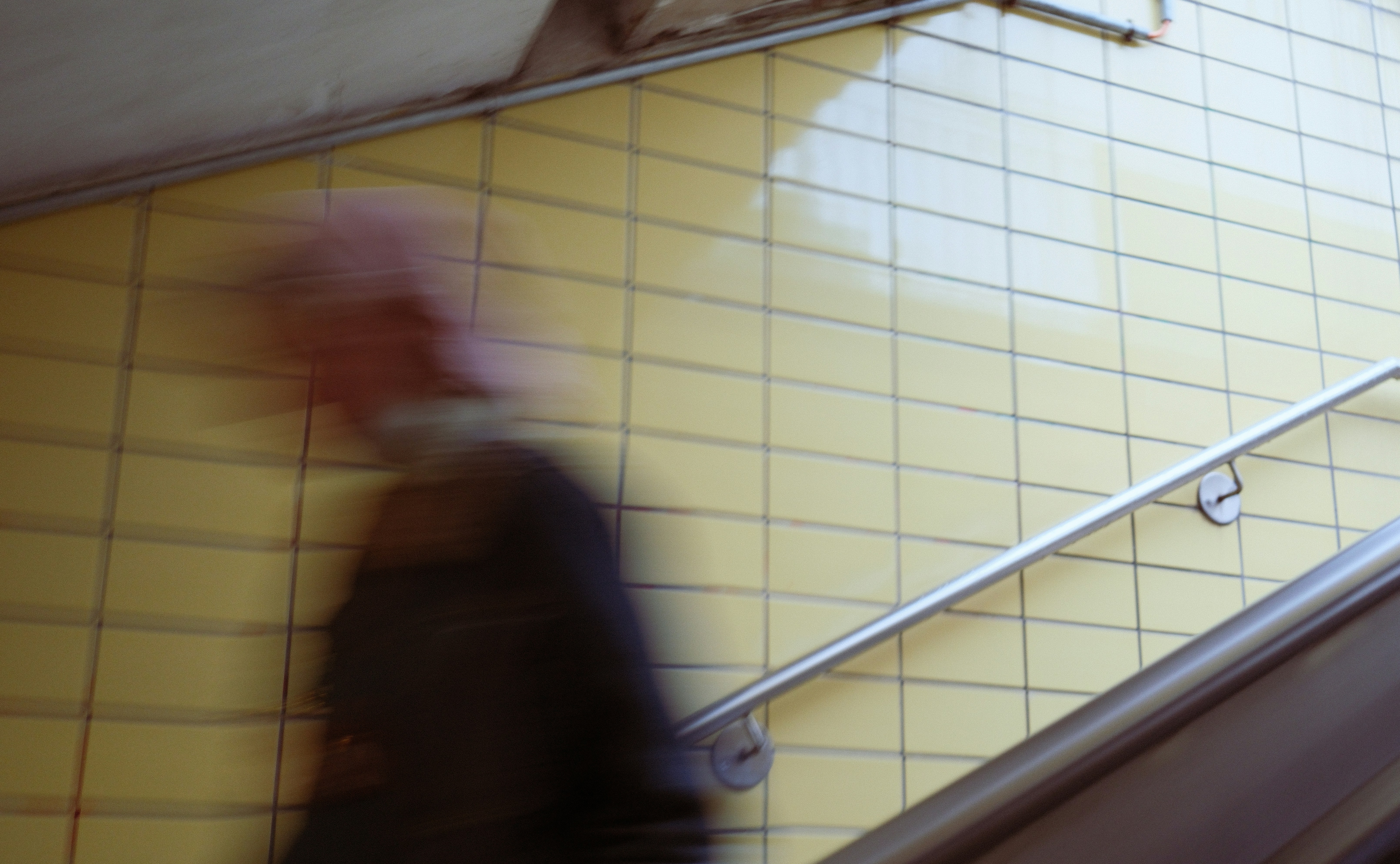Motion on the Yellow Stair: A Ghostly Figure Descends