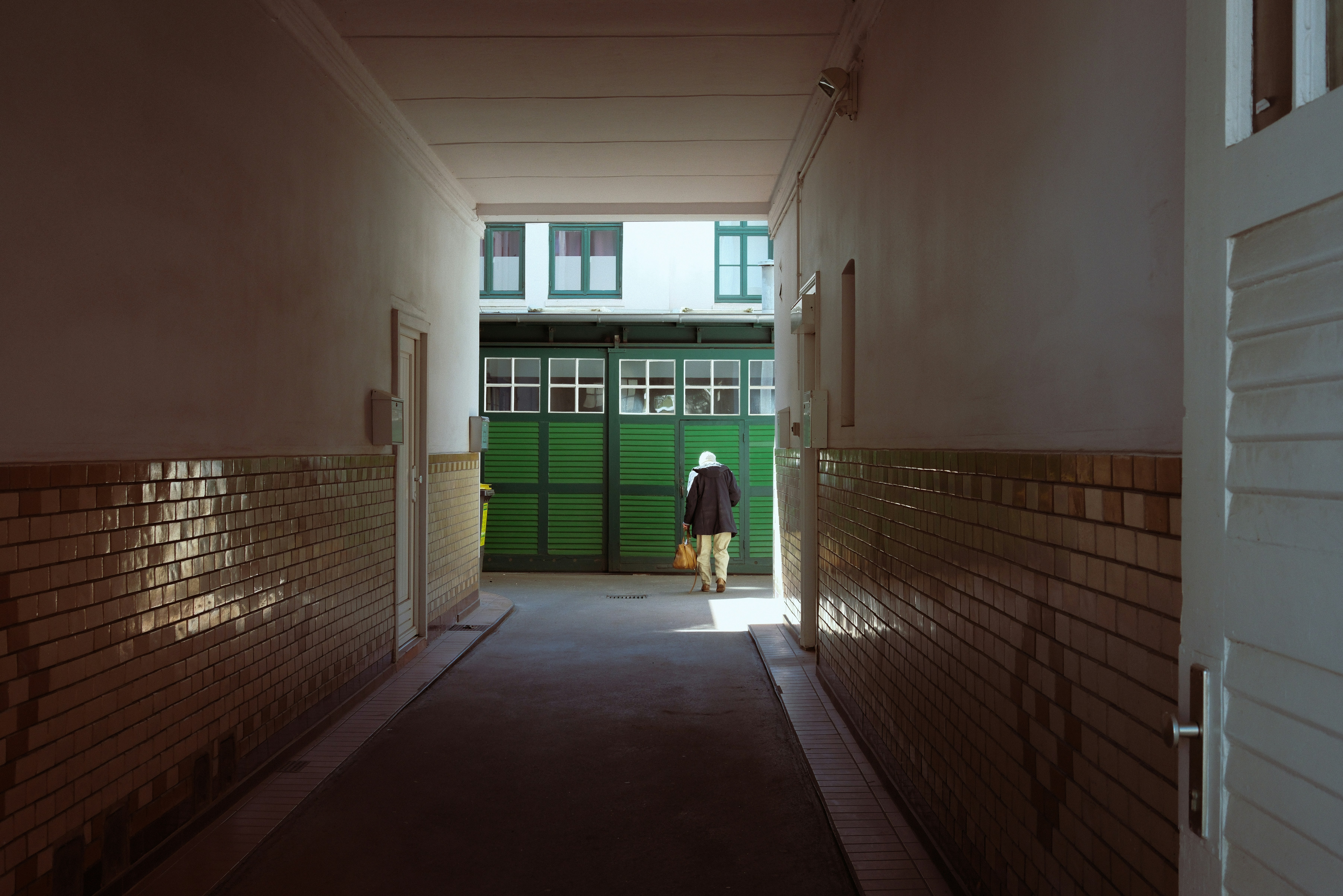 Light at the End: A Quiet Corridor to a Green Gate