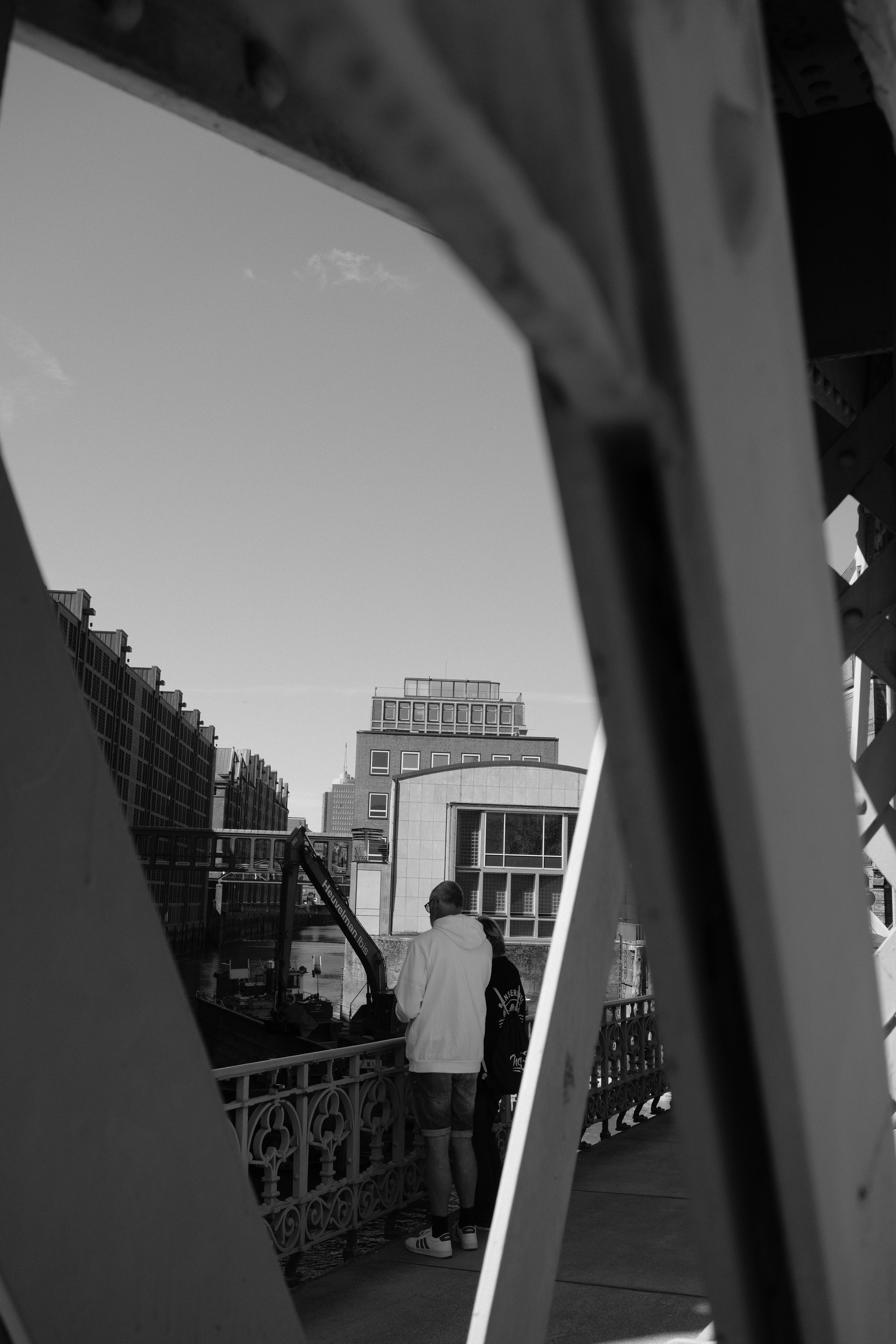 City Balcony: Quiet Encounter on the Bridge