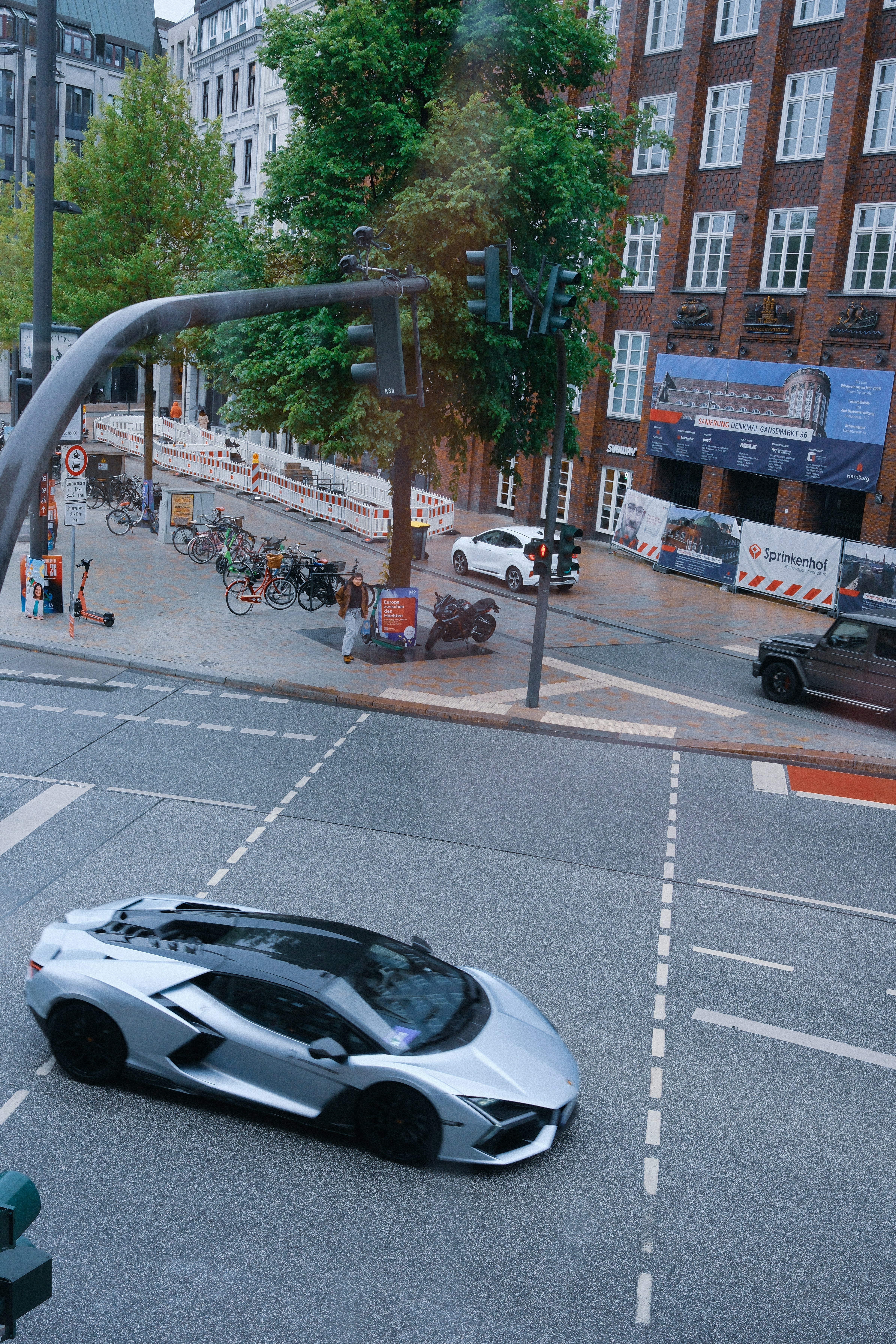 Street Swift: A Supercar Races Past a City Block