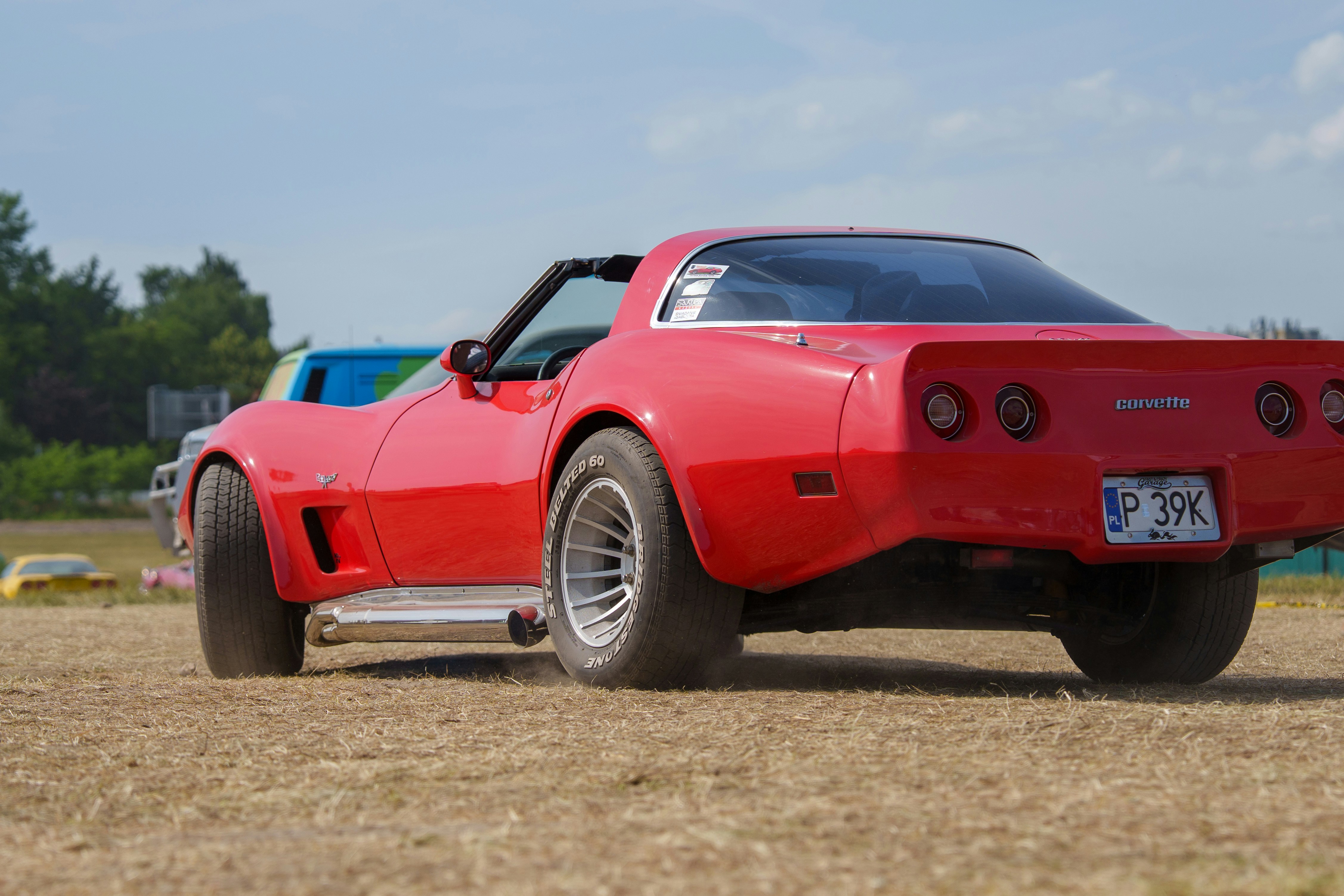 Red Corvette on a Parched Field: A Low-Ride Sunset Run