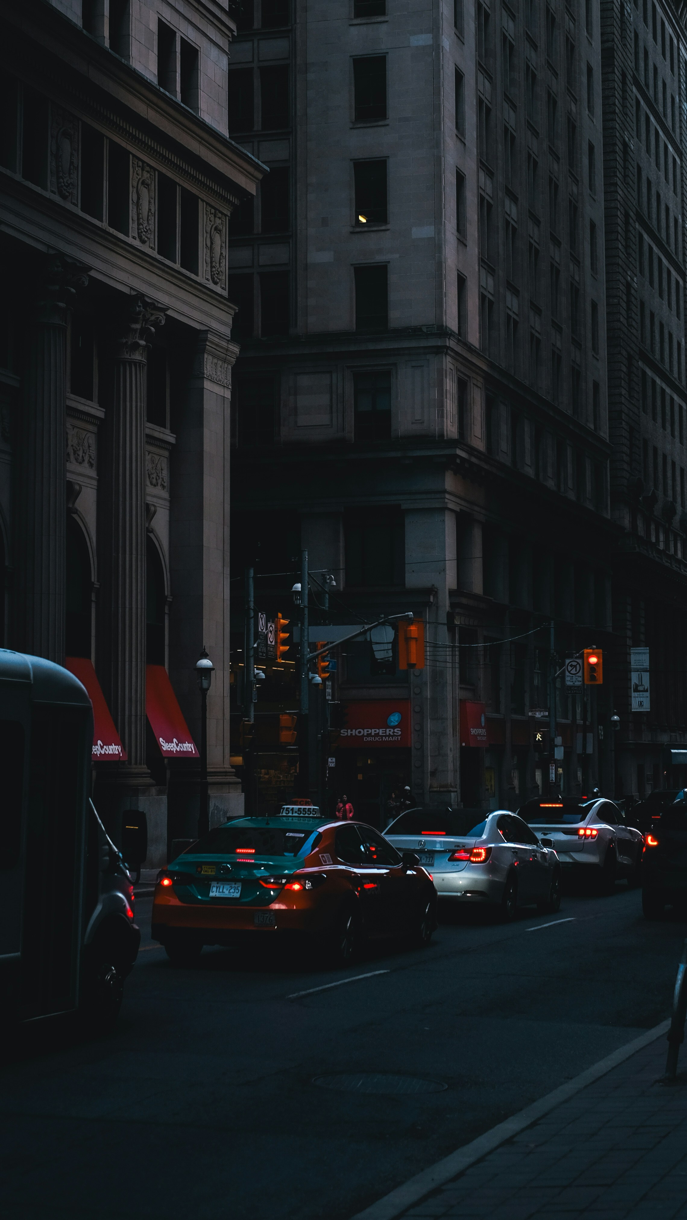 Midtown Dusk: Cars, City Lights, and Shadows