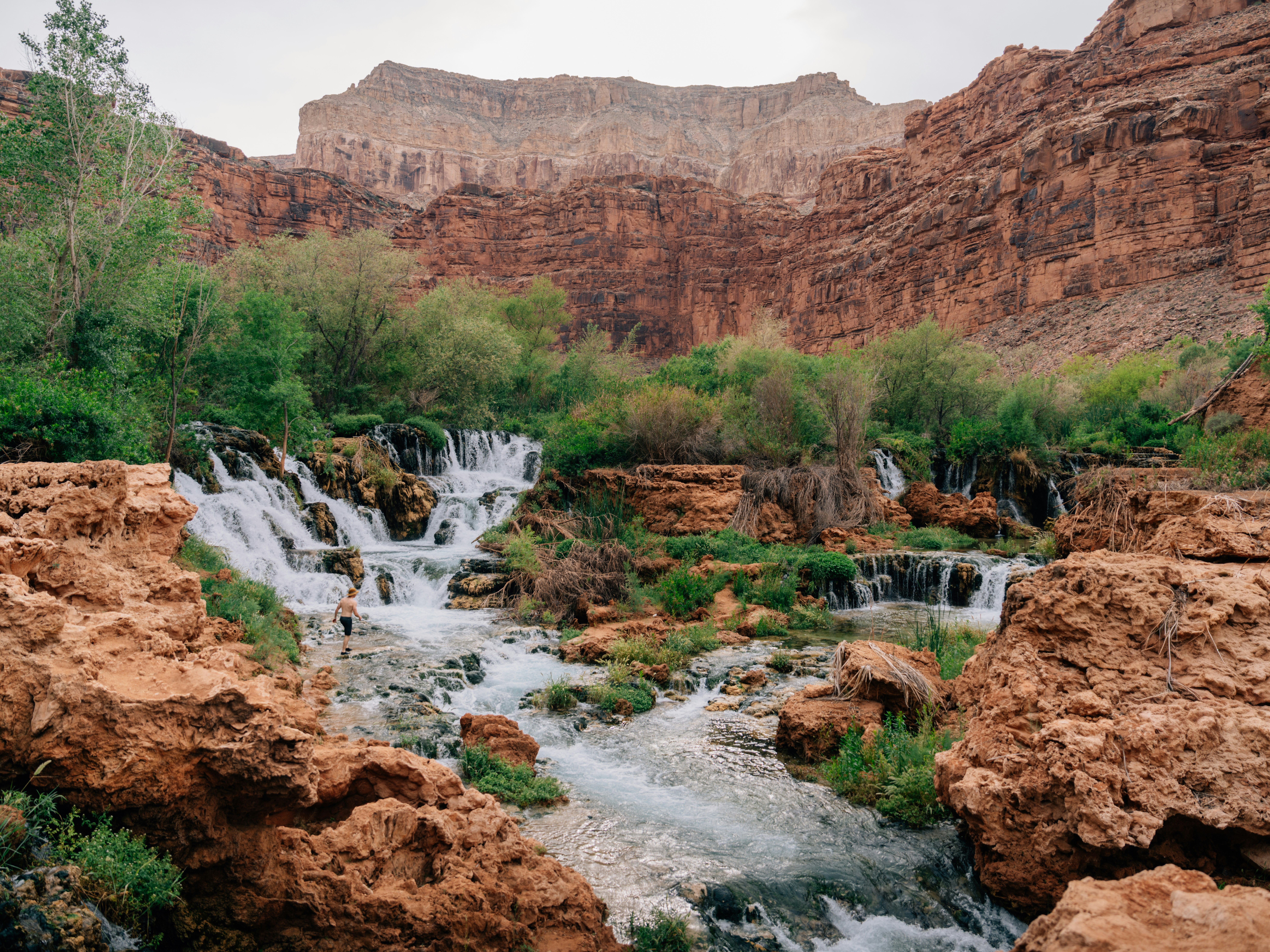Cascading Oasis Amid Rusty Cliffs
