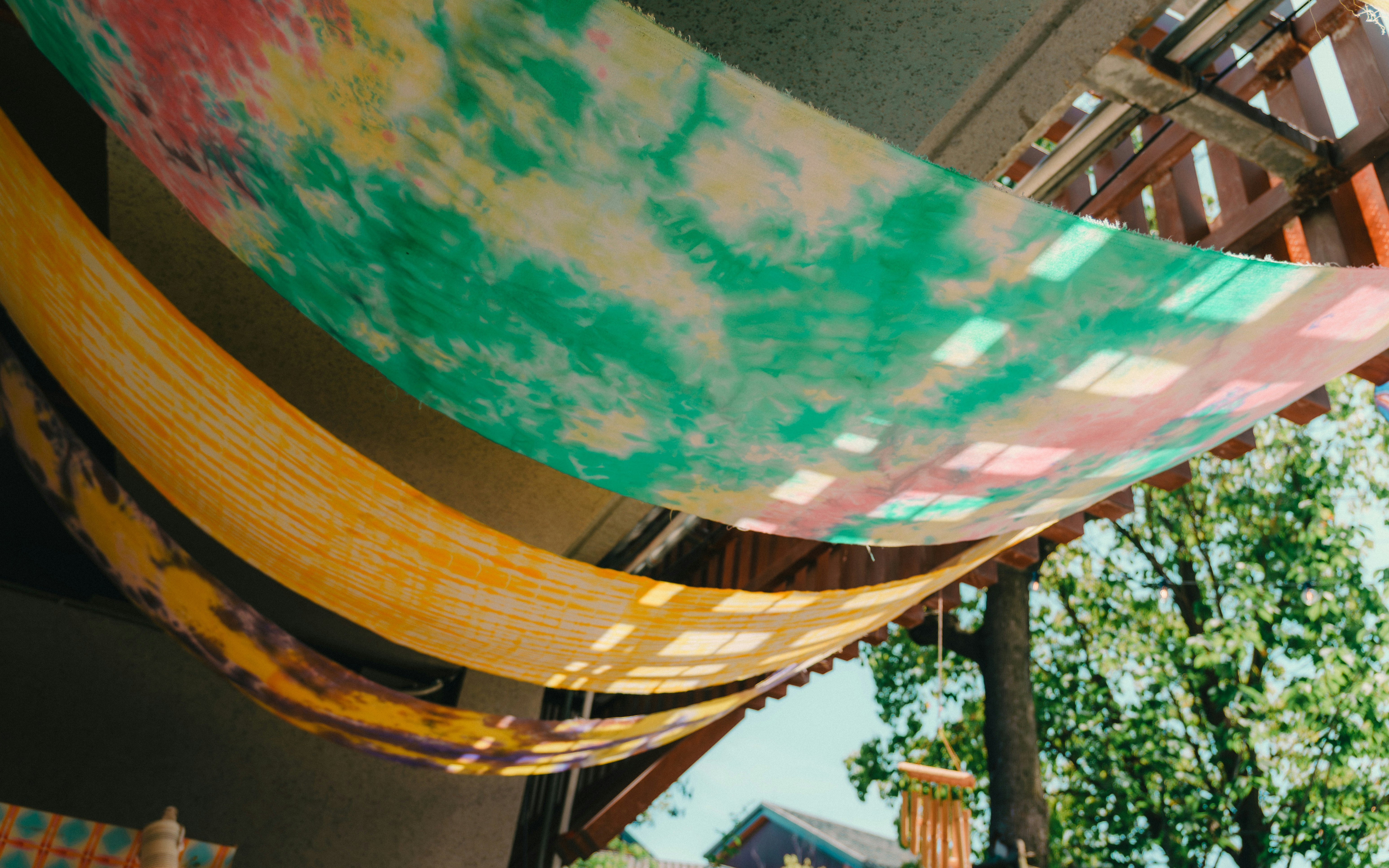 Colorful Drapes Against Sunlit Terrace