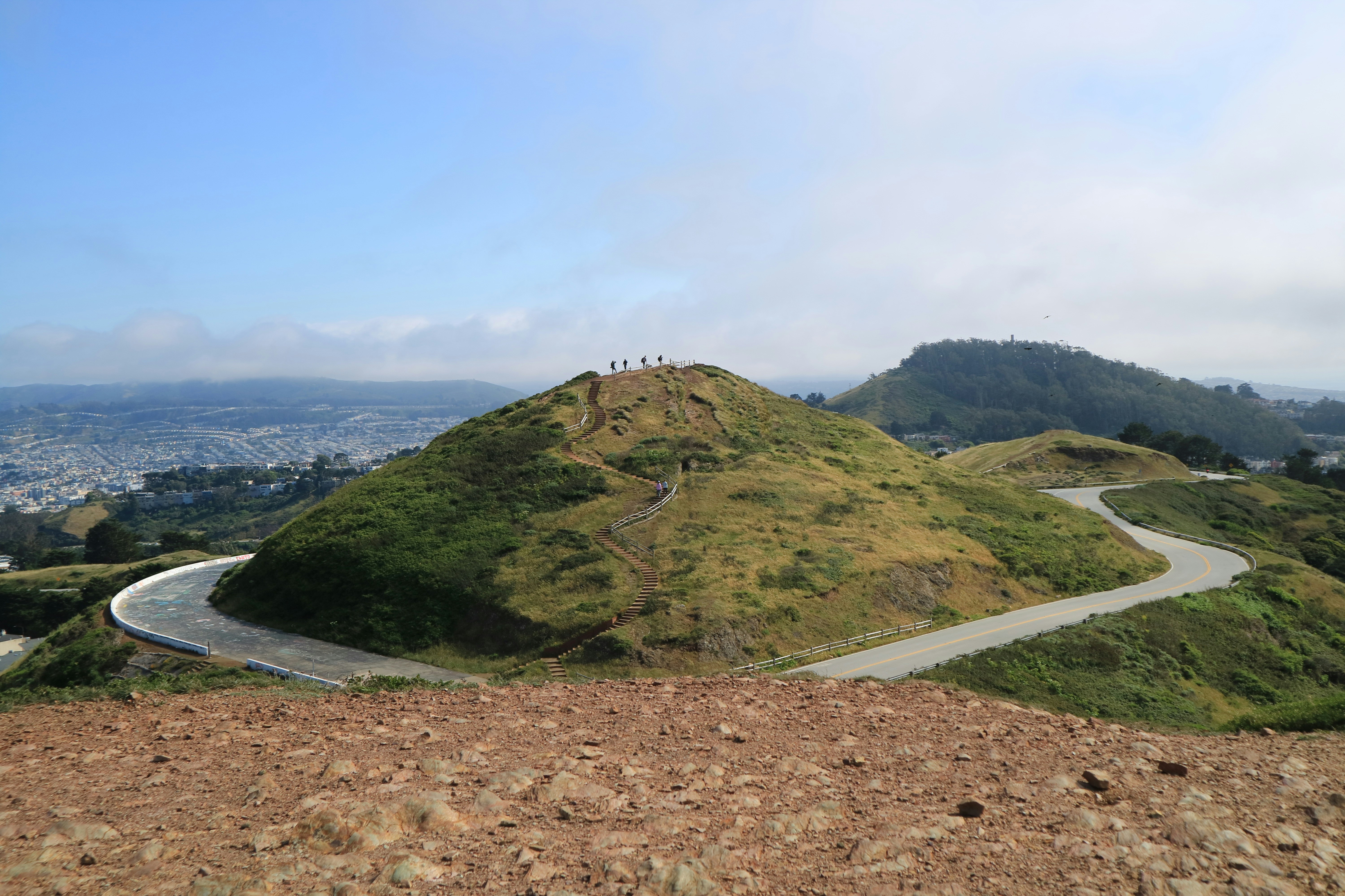 Twisting Summit: Bypass Road Winding Up a Rolling Hill