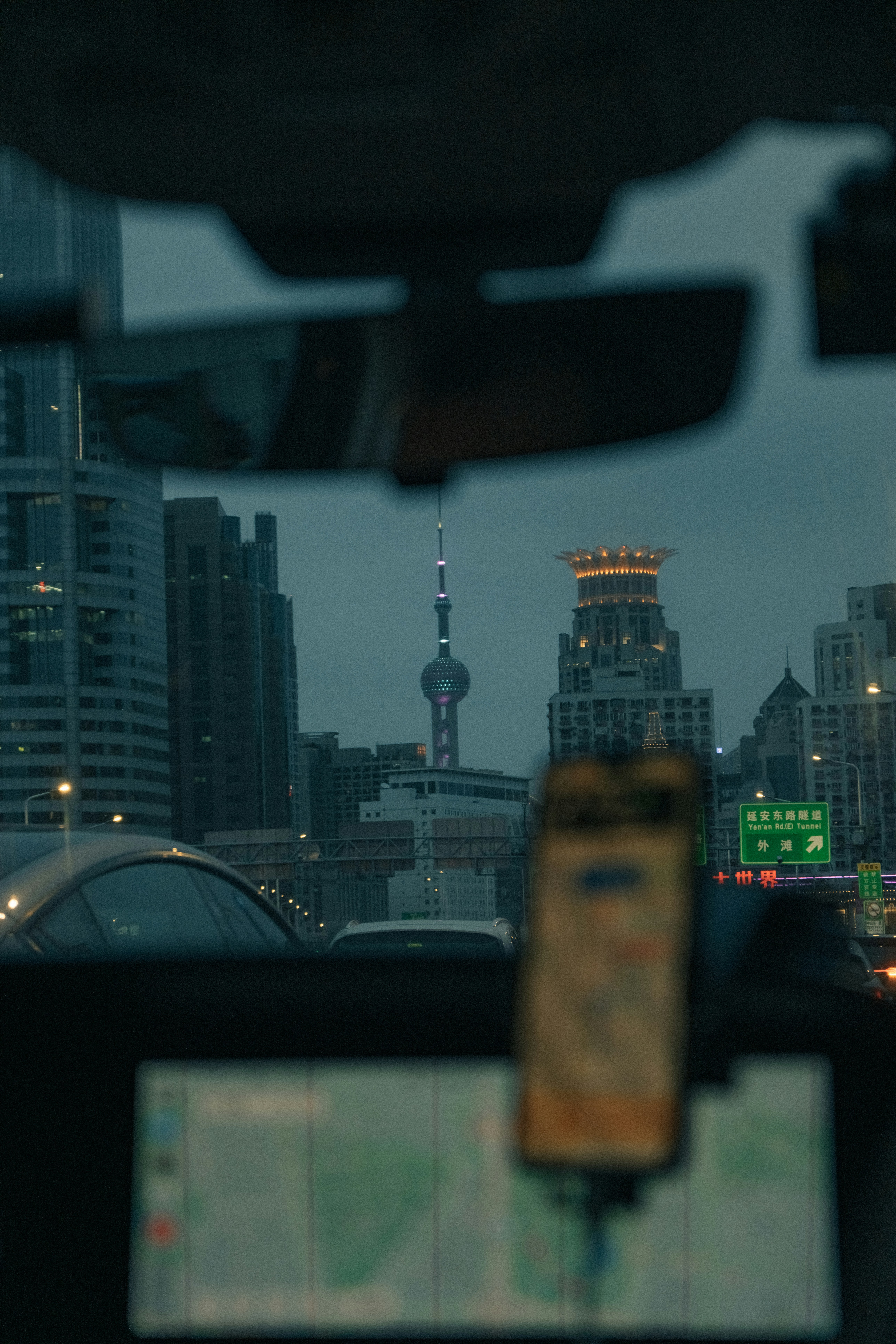 City Reflections: A Passenger's View of Neon Towers from the Morning Dash
