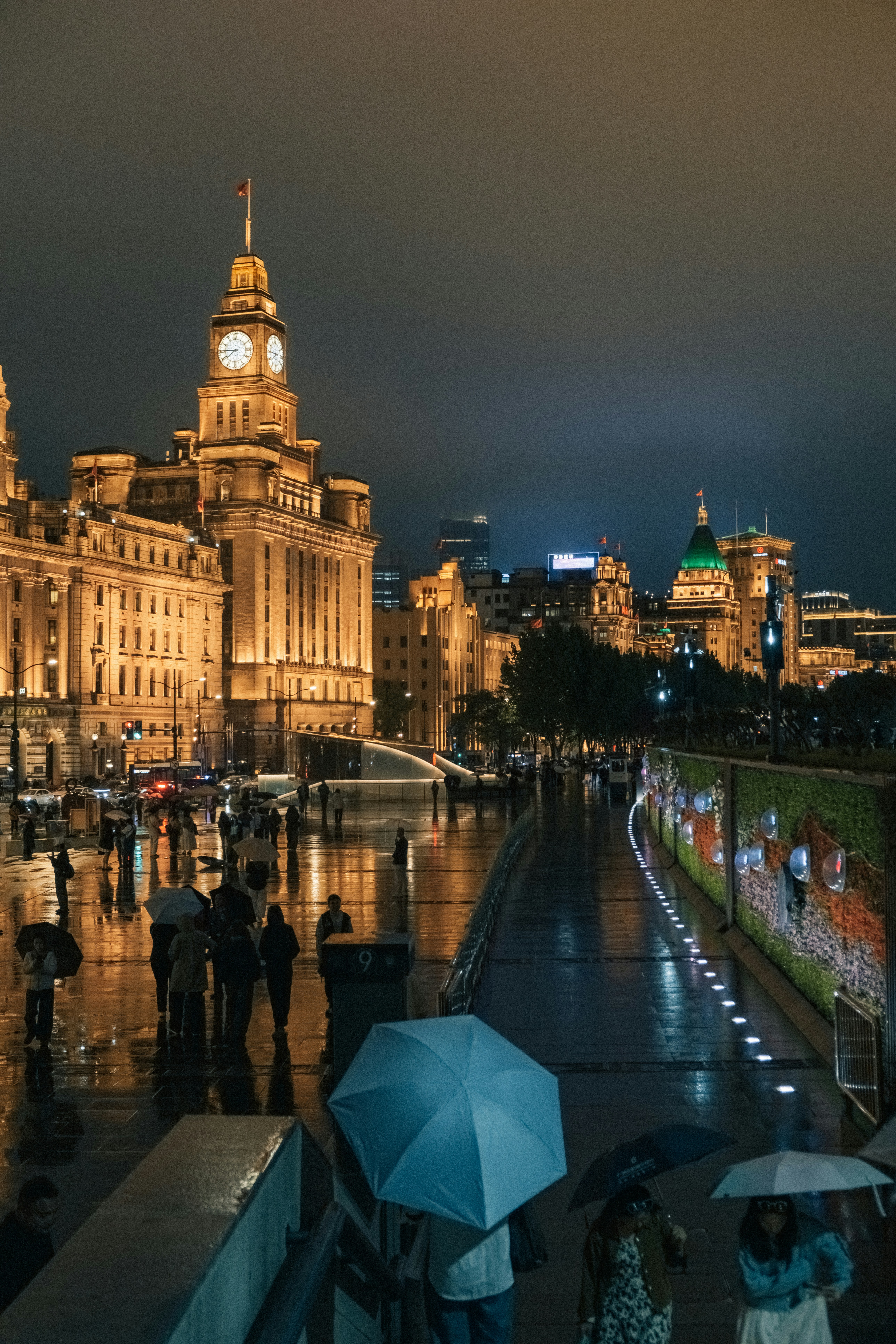 City at Twilight: The Clock Tower Over a Glimmering Riverwalk