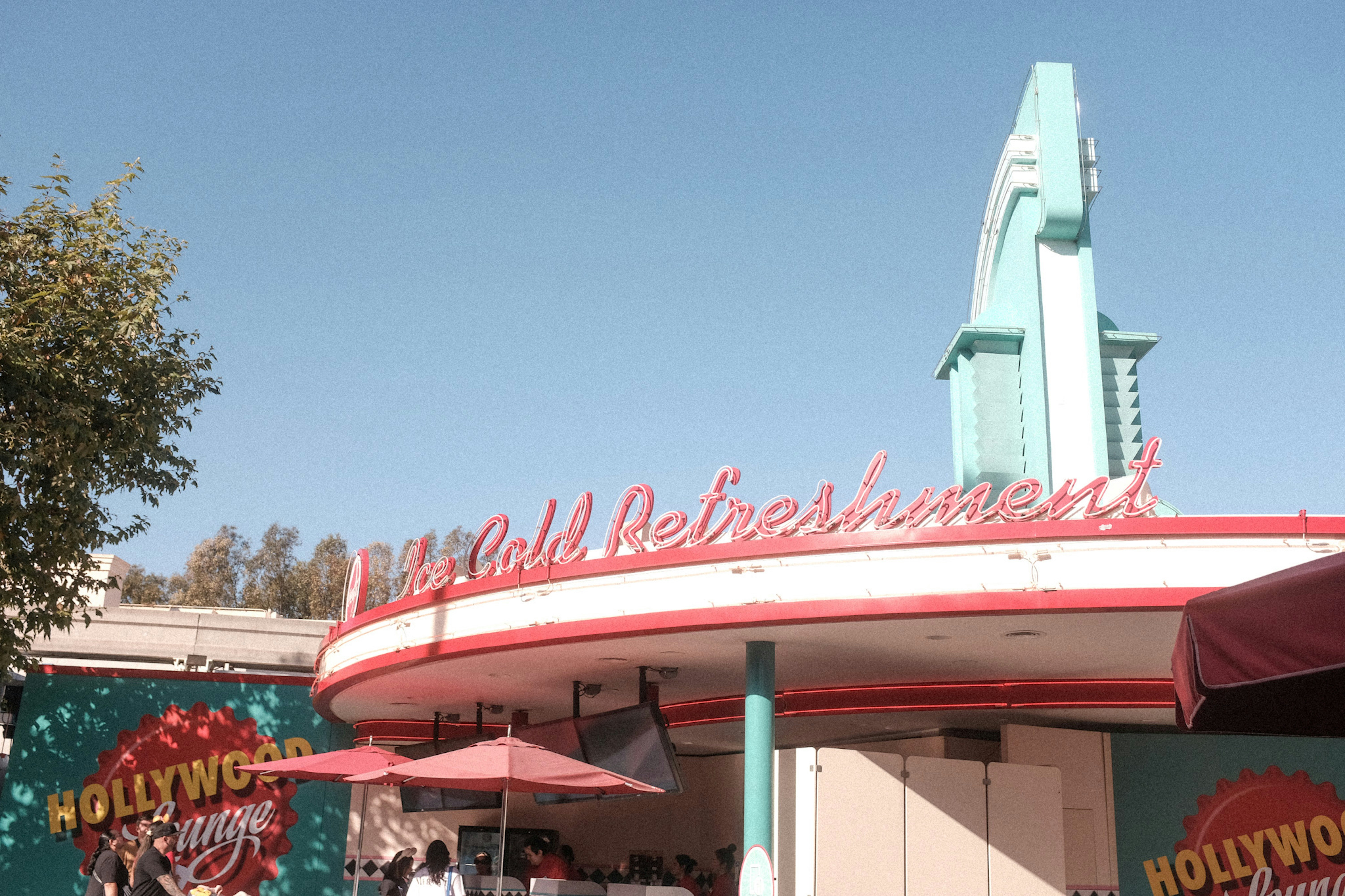 Neon Sign and Retro Drive-In Facade at Sunset Showdown