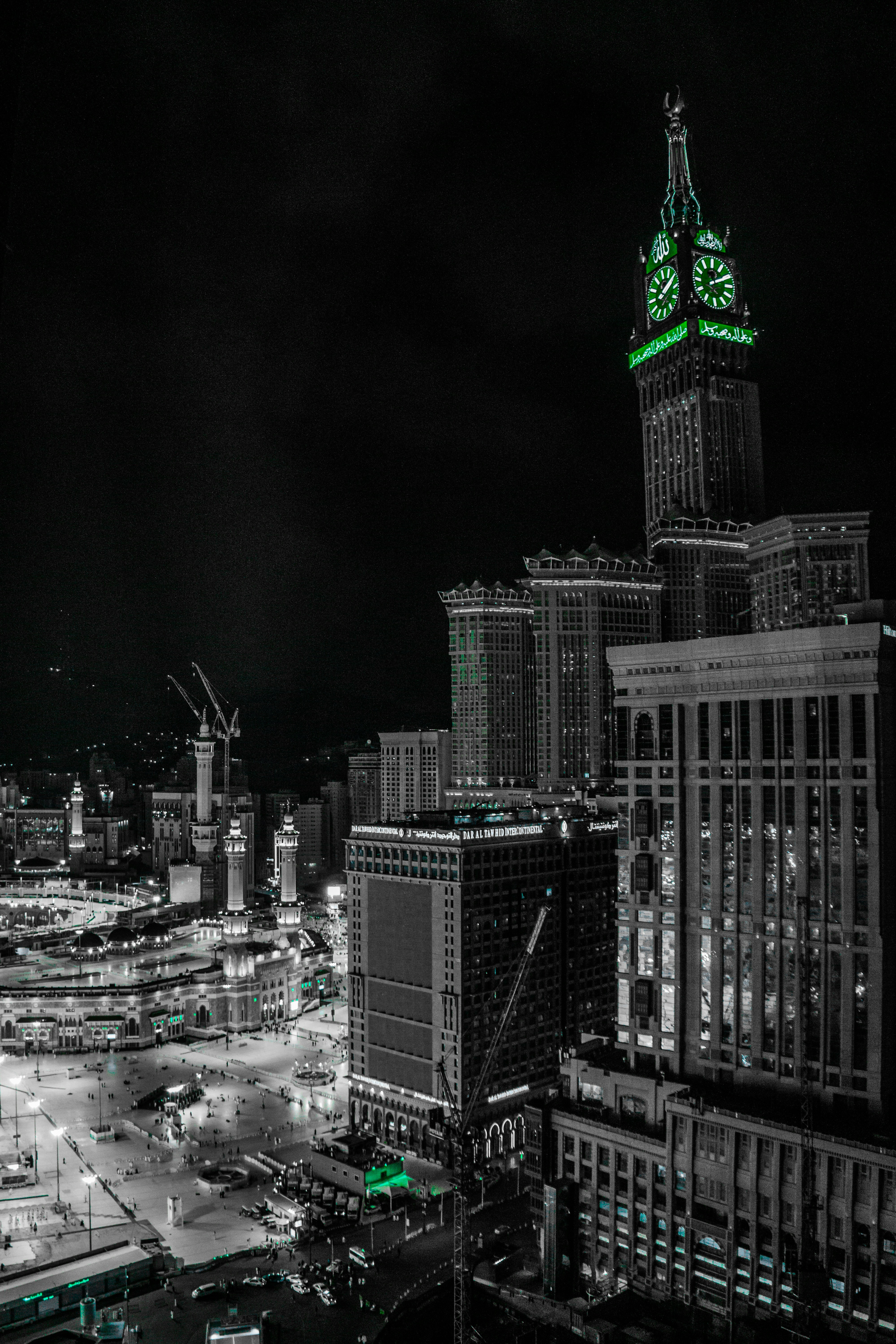Emerald Clocktower Overlooking a Neon-Hued Skyline