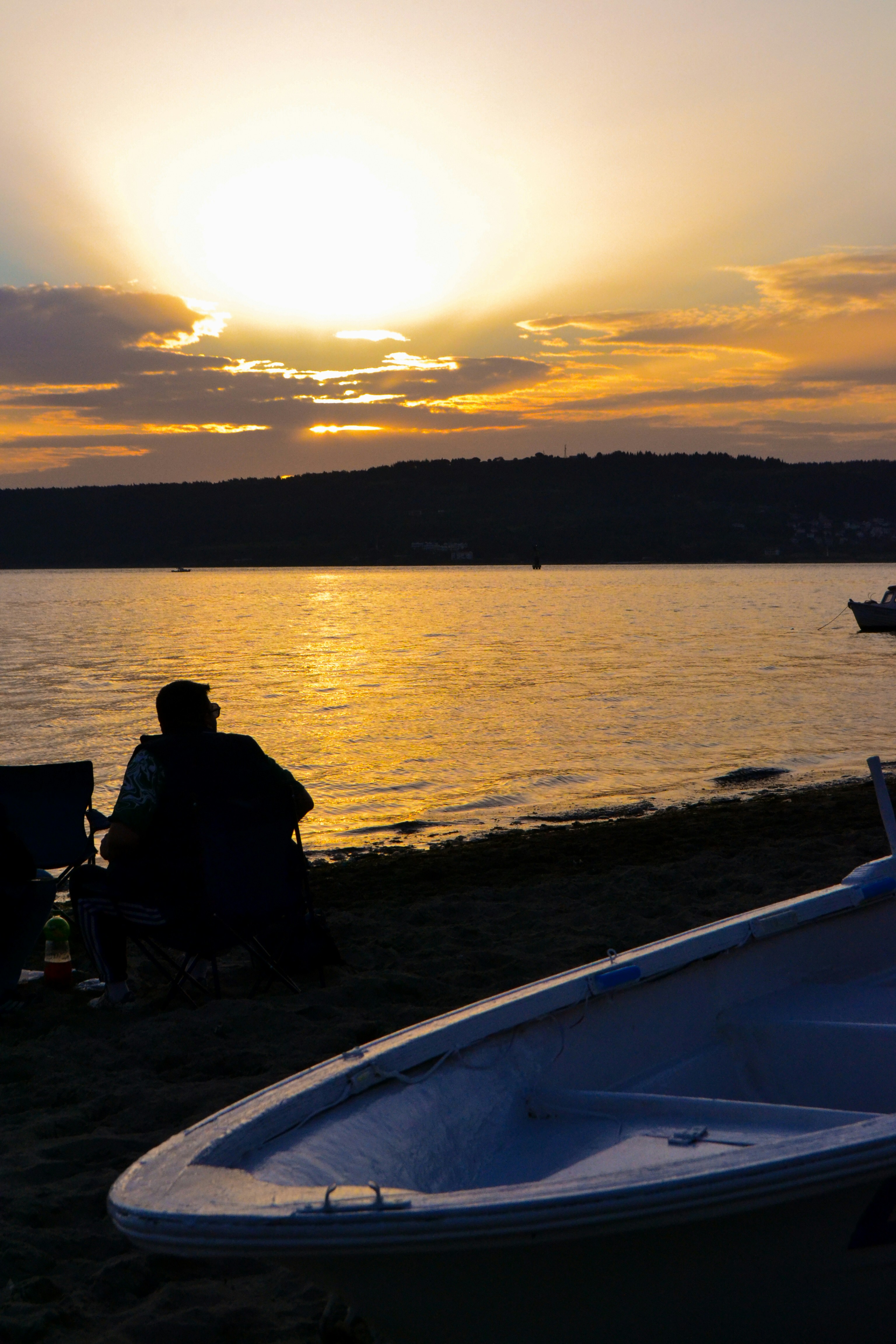 Sunset Silence by the Shore with a Quiet Boat