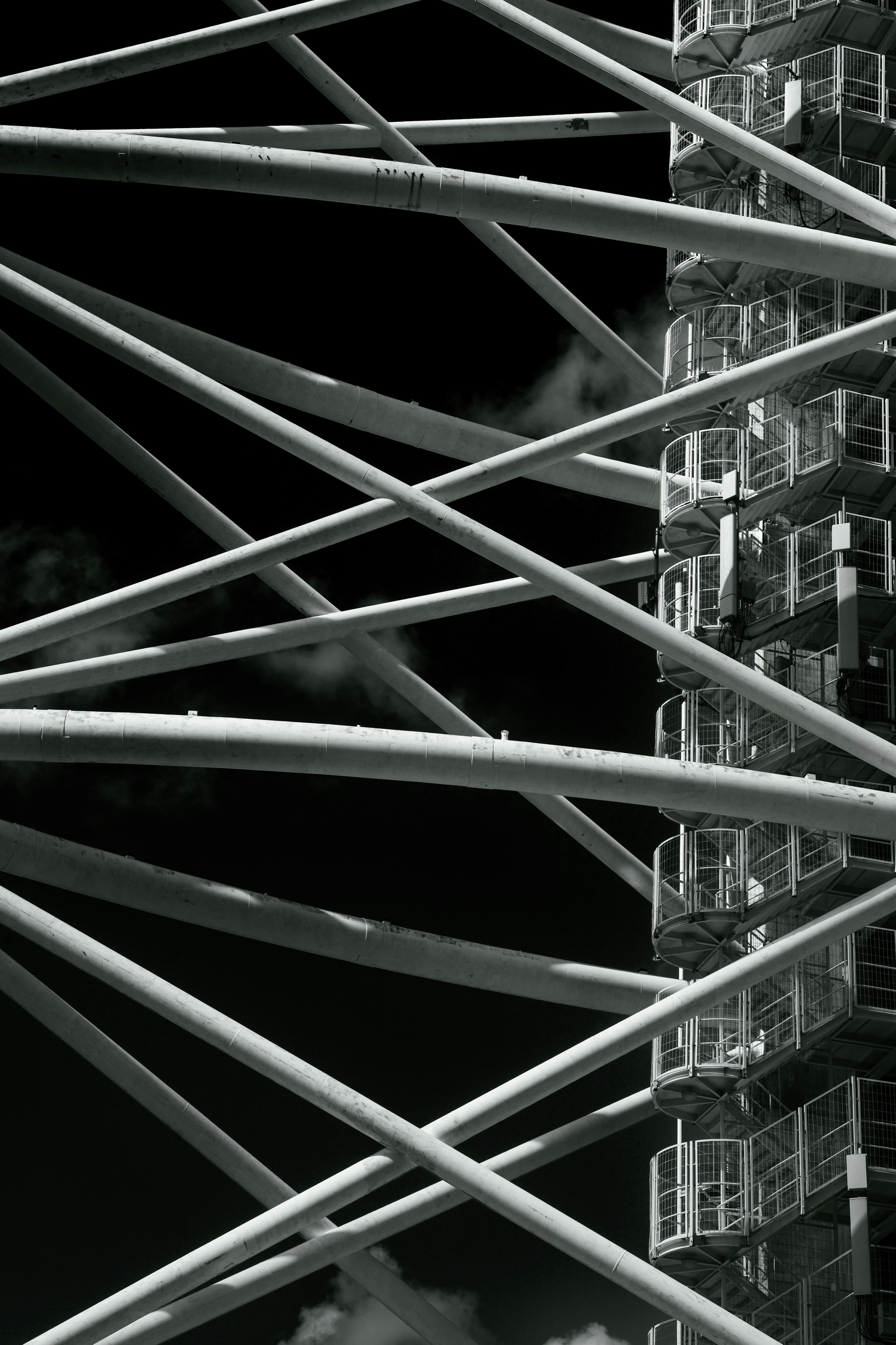 Crisscross of Steel: Structural Mesh Against a Dark Sky