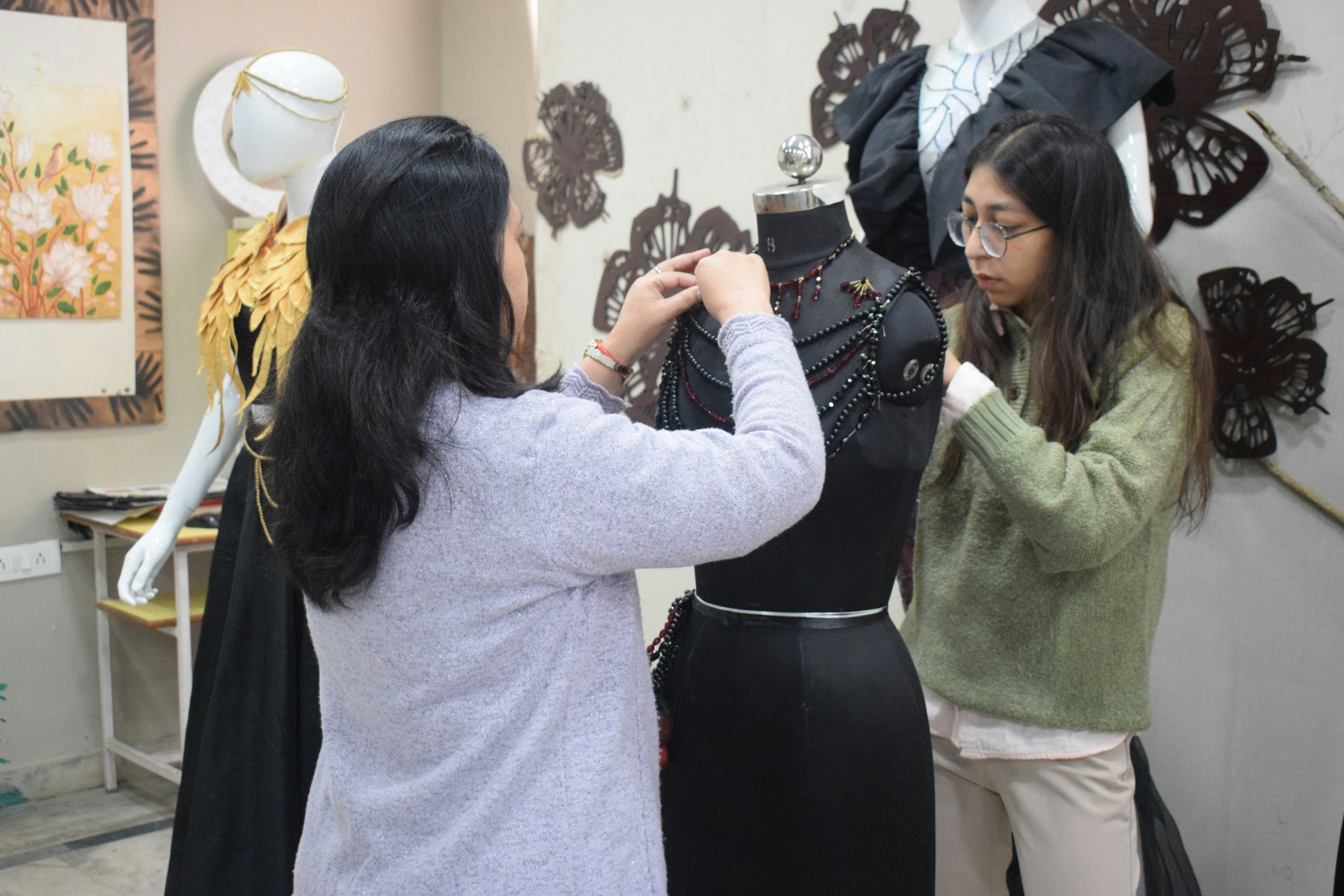 Tailor’s Moment: Dressed Mannequin, Two Assistants and a Crafting Encounter