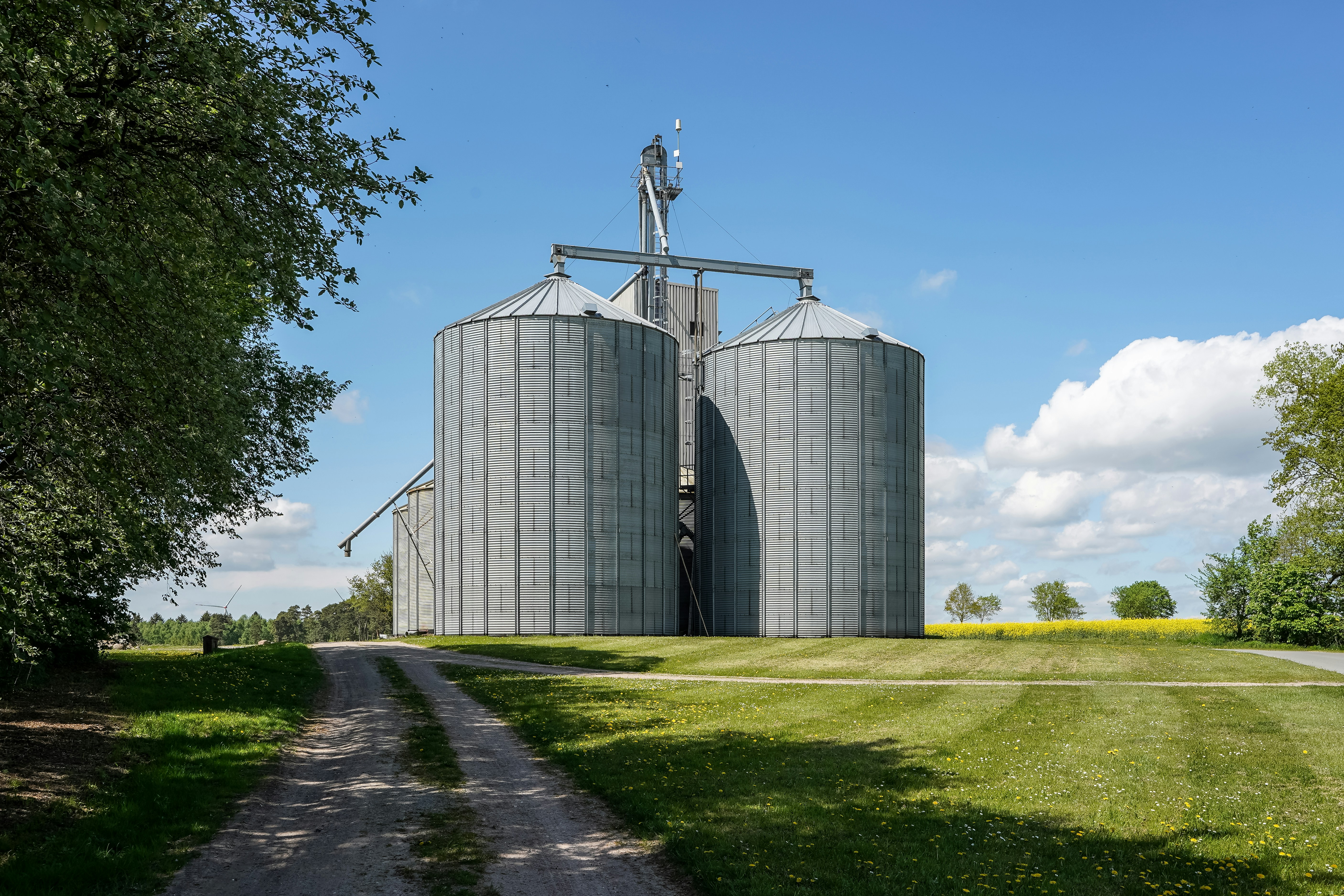 Twin Silos Under a Wide Blue Sky