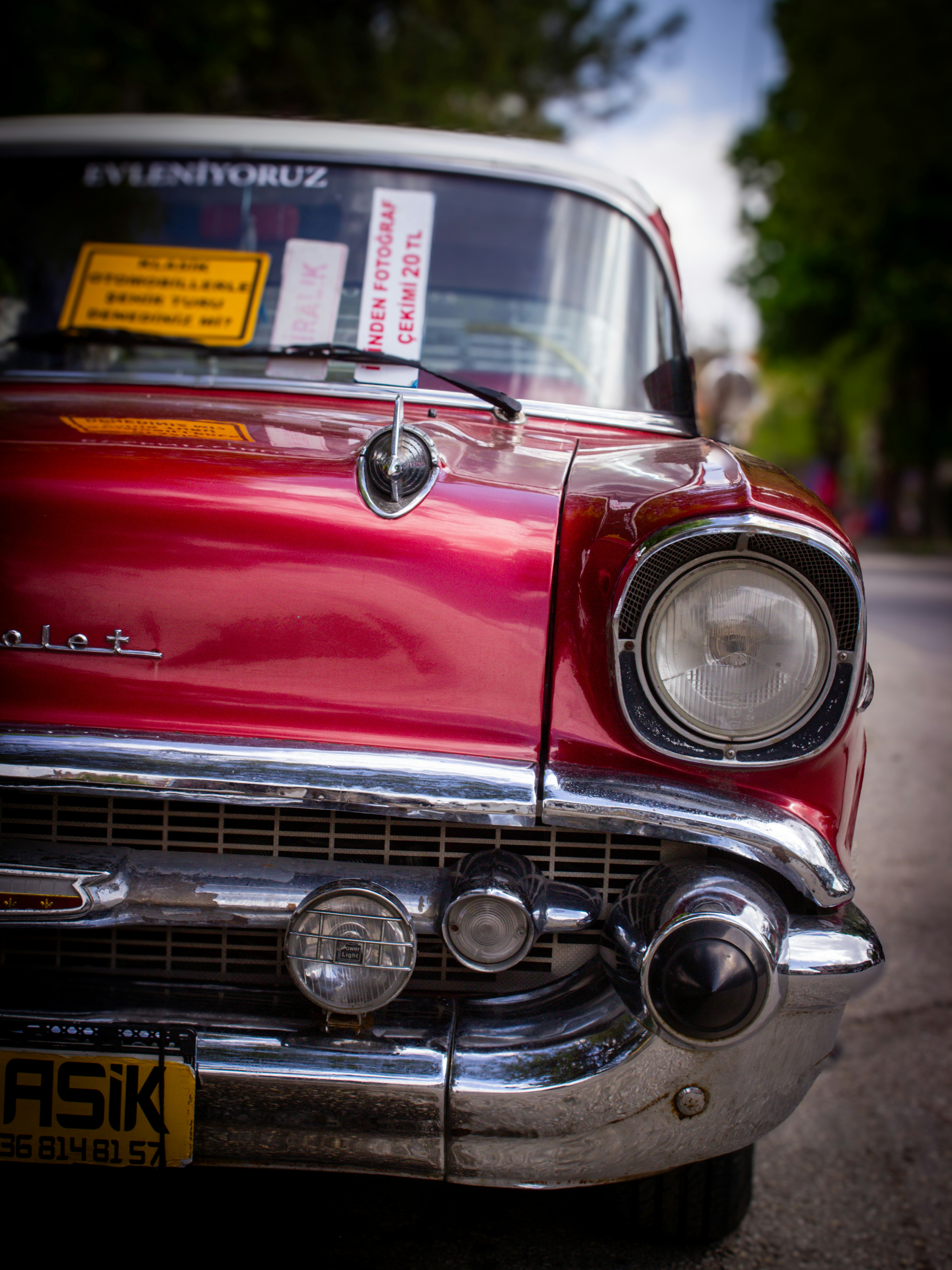 Chrome Crown: The Front Quarter of a Classic Red Chevrolet