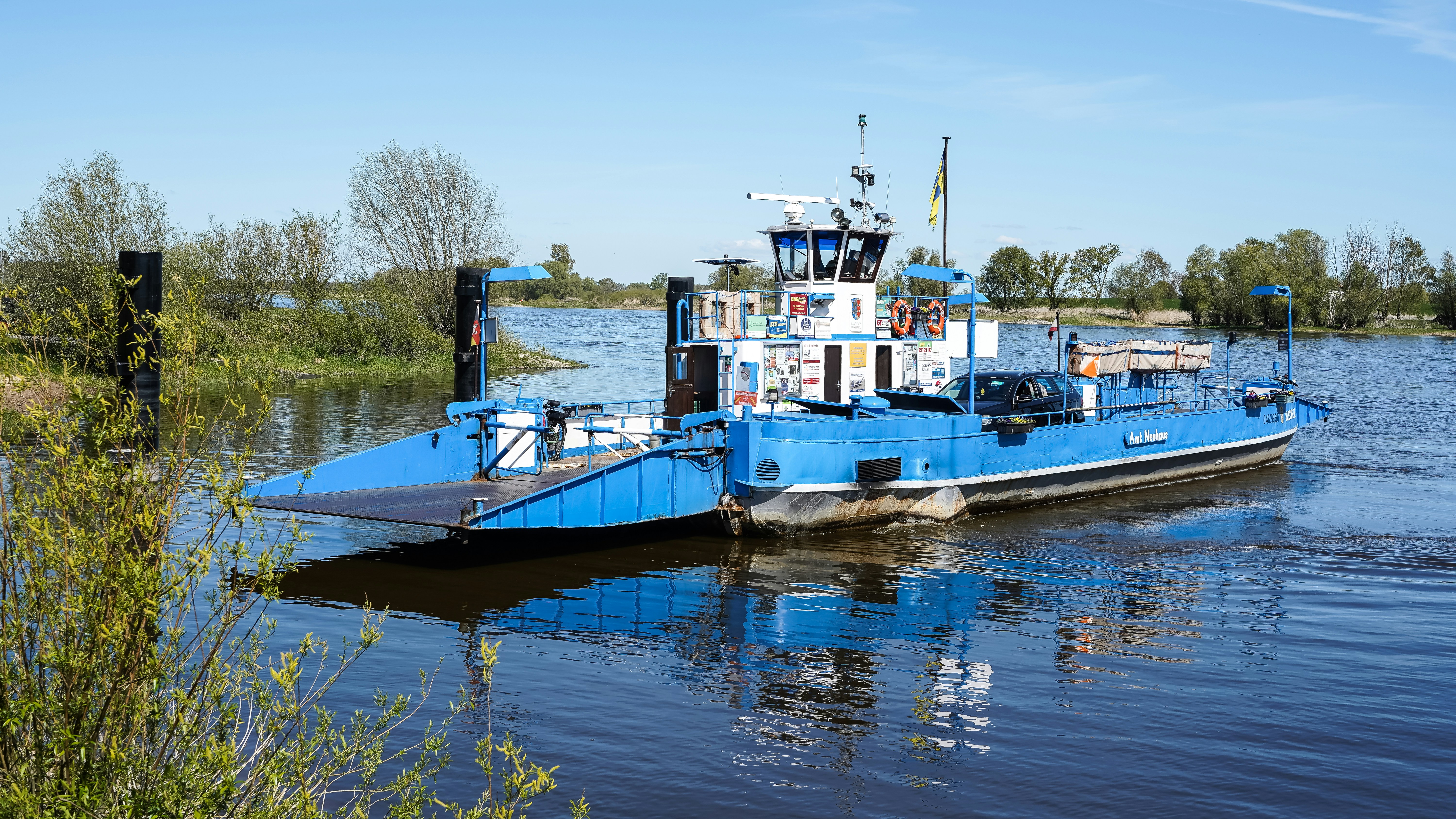 Blue River Workboat at Rest: A Quiet Wake Along the Docks