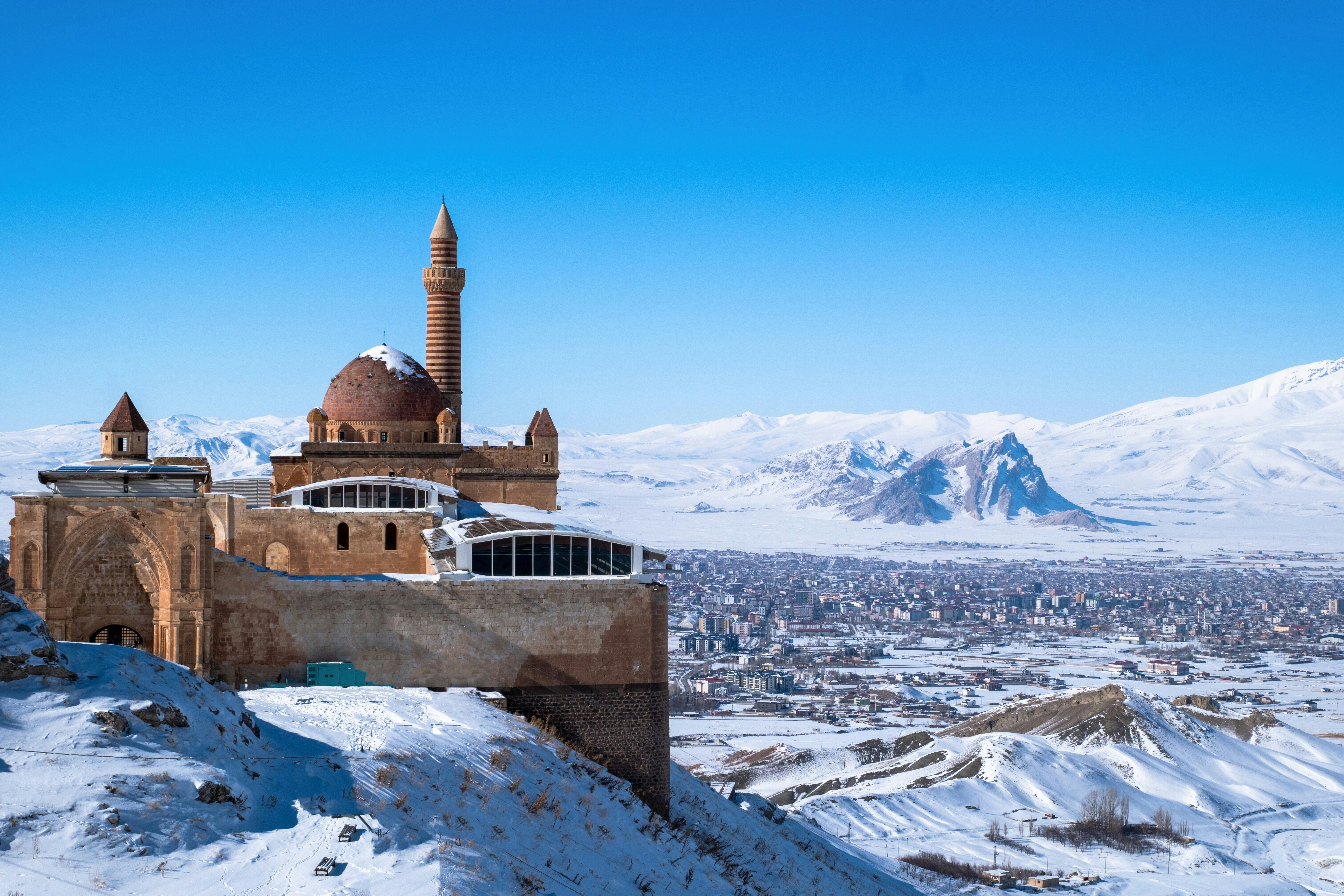 Snowbound Citadel: The Emirate Clocktower Over the White Ridge