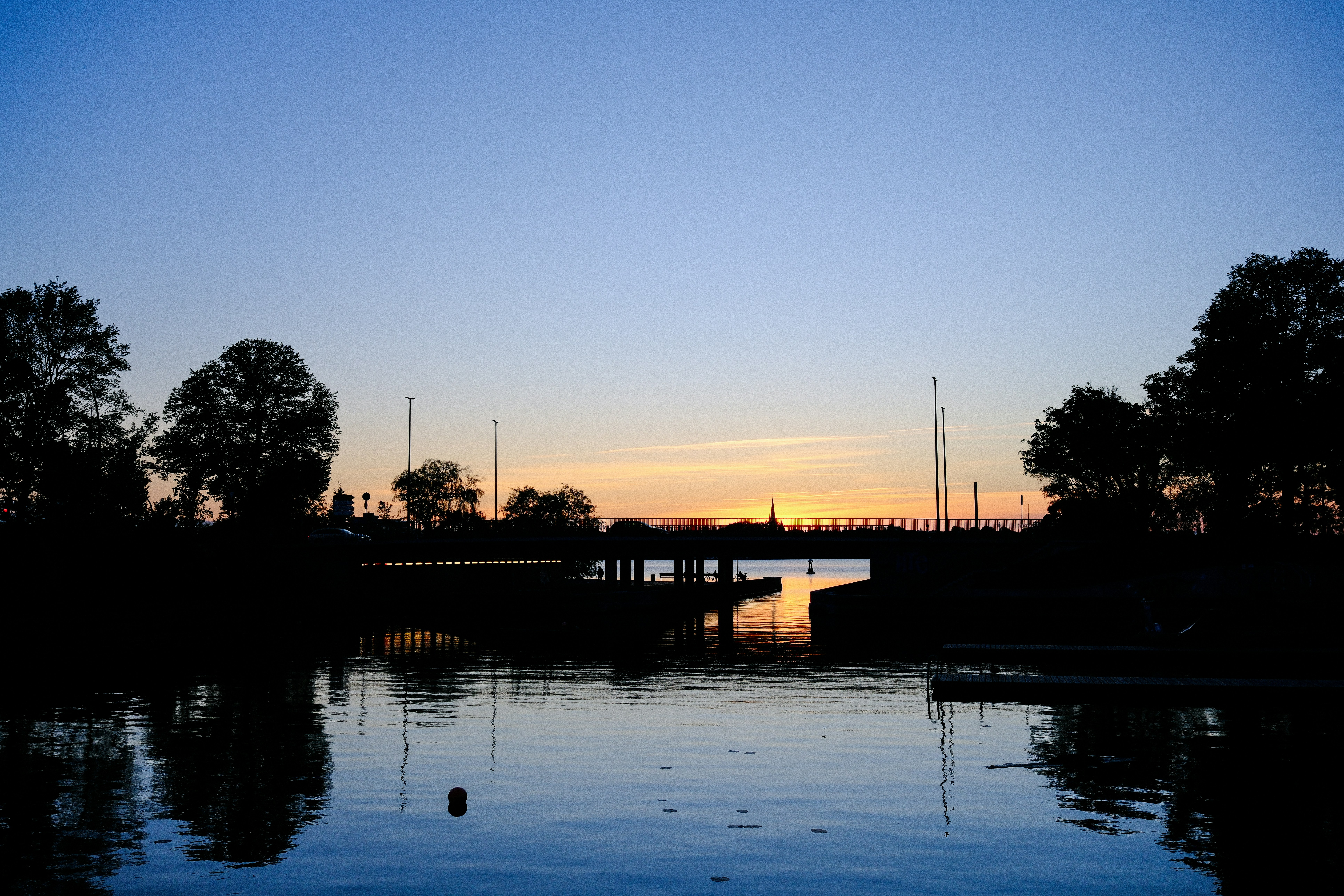 Silhouette over the Quiet Water at Dusk