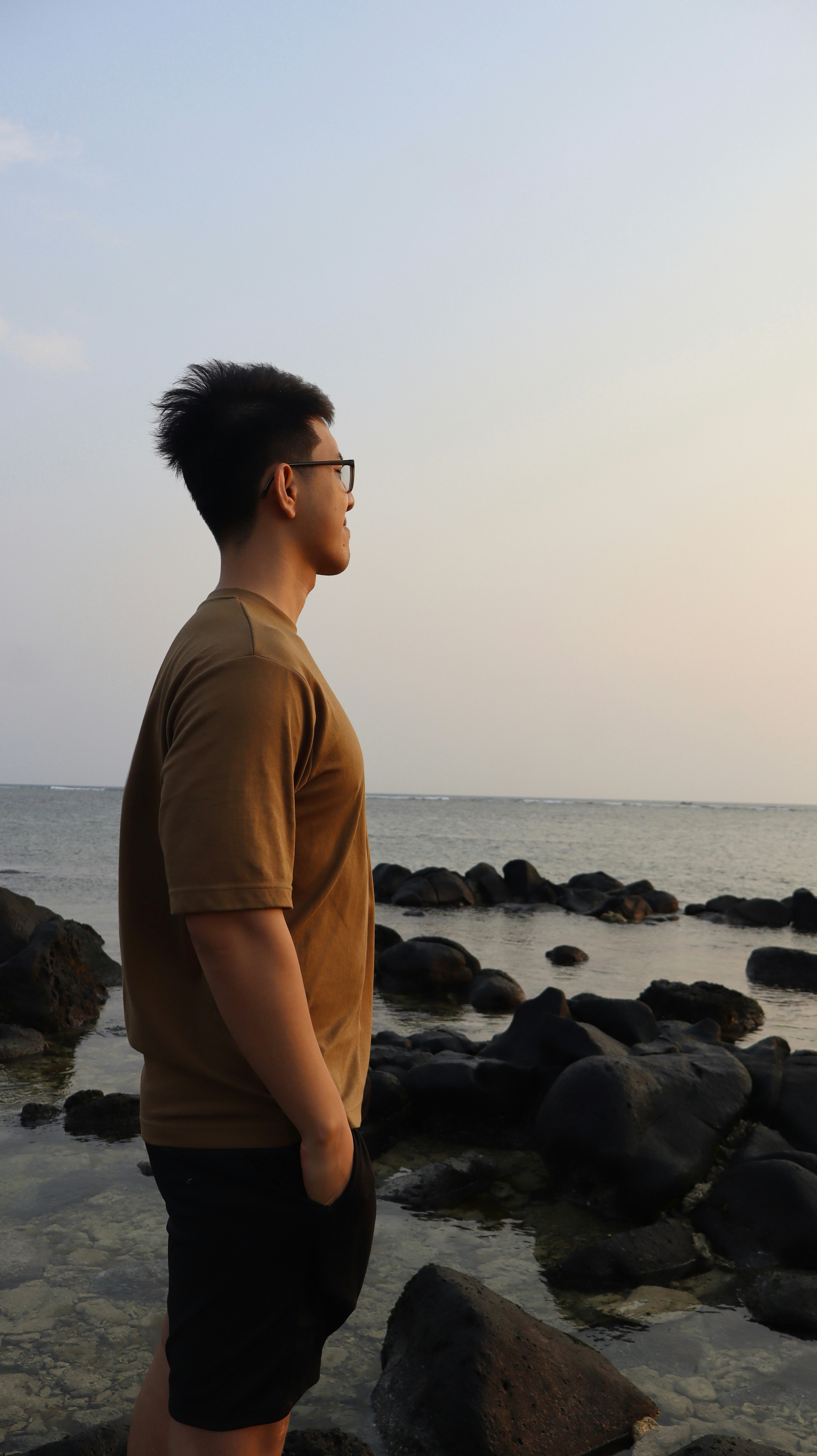 Seaside Profile: Man in Warm Tones gazes toward a quiet horizon