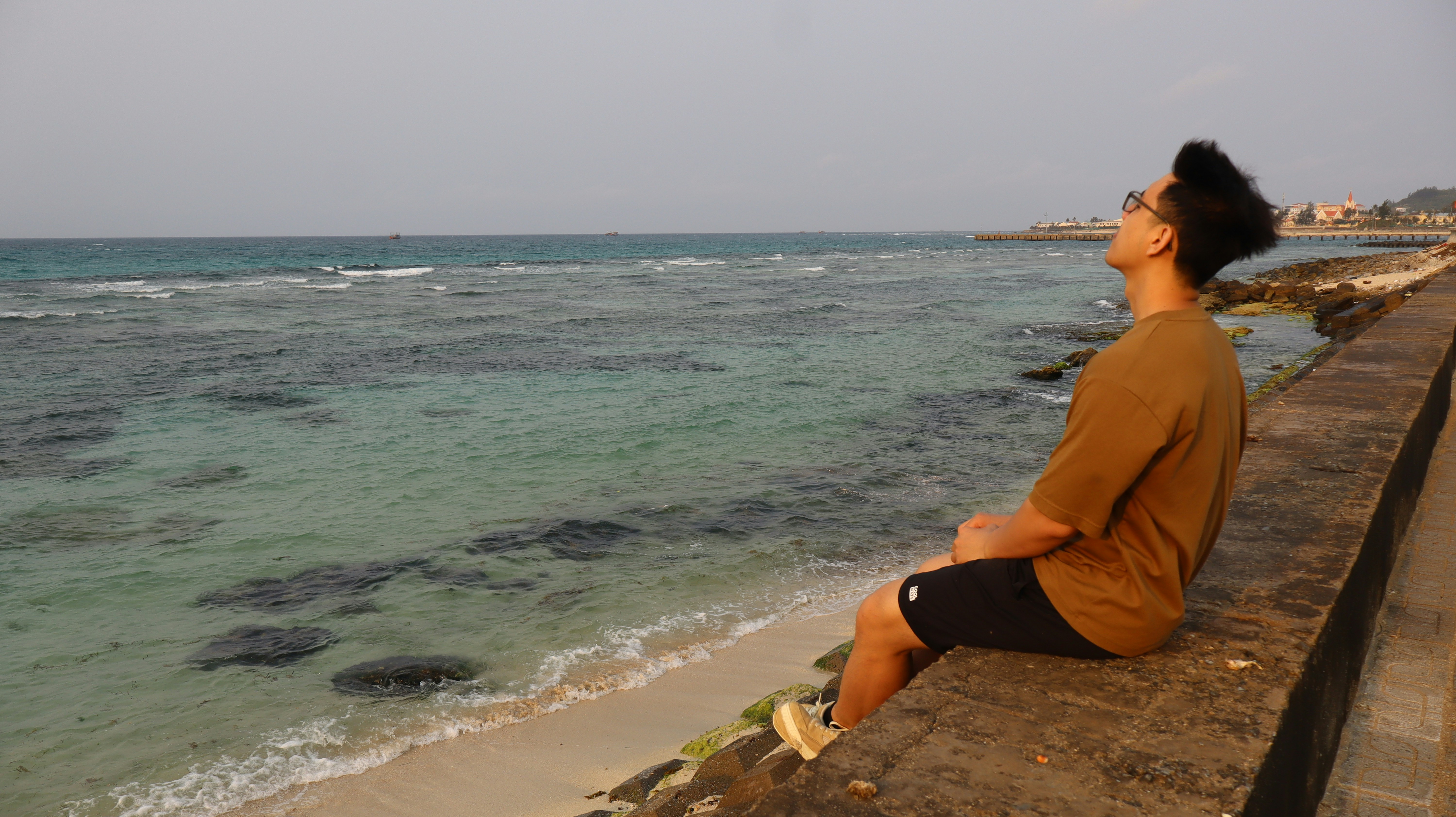 Horizon Gazing: A Quiet Moment on the Seawall