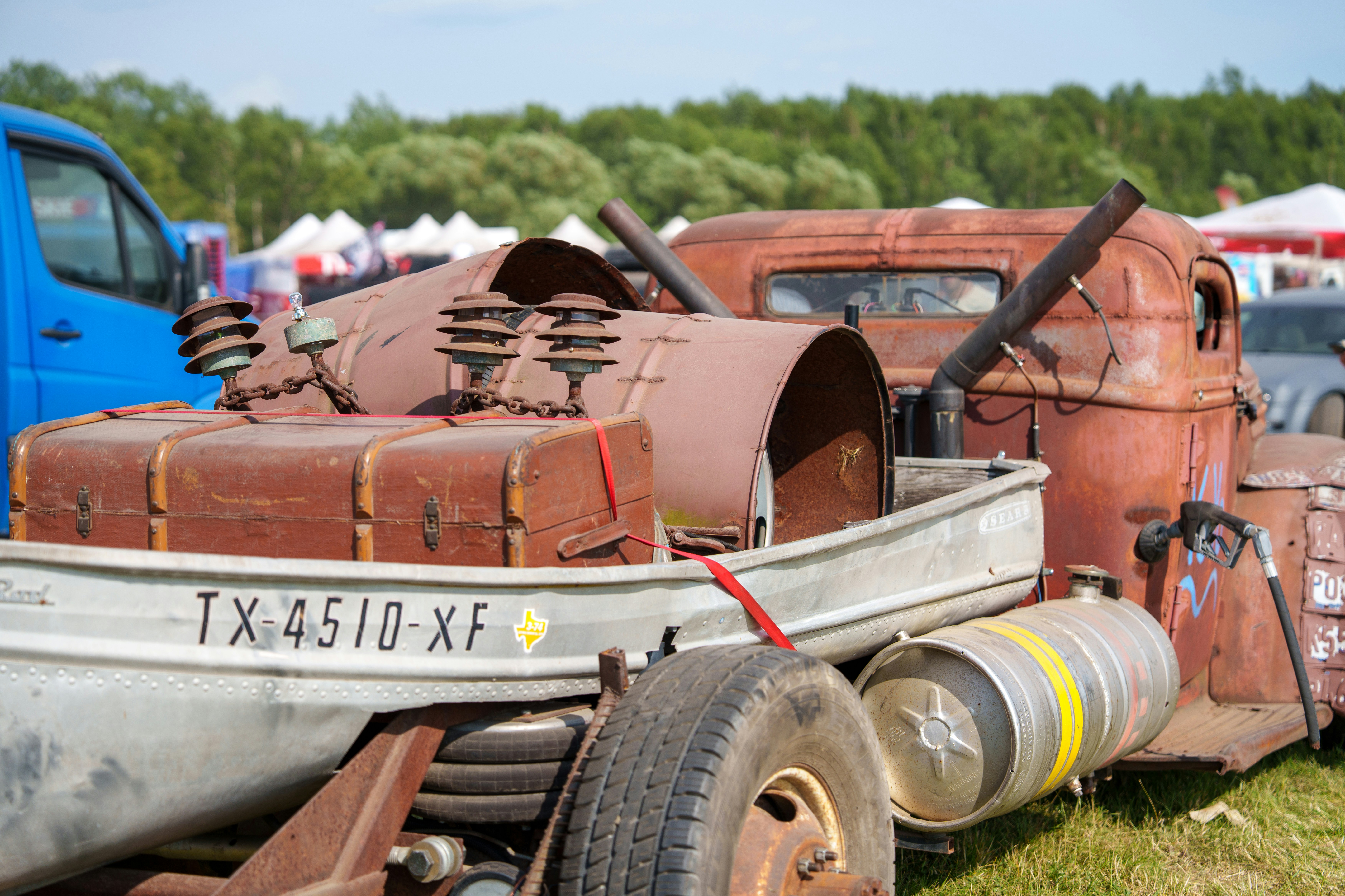 Rust and Riveted: A Row of Weathered Machinery in a Field