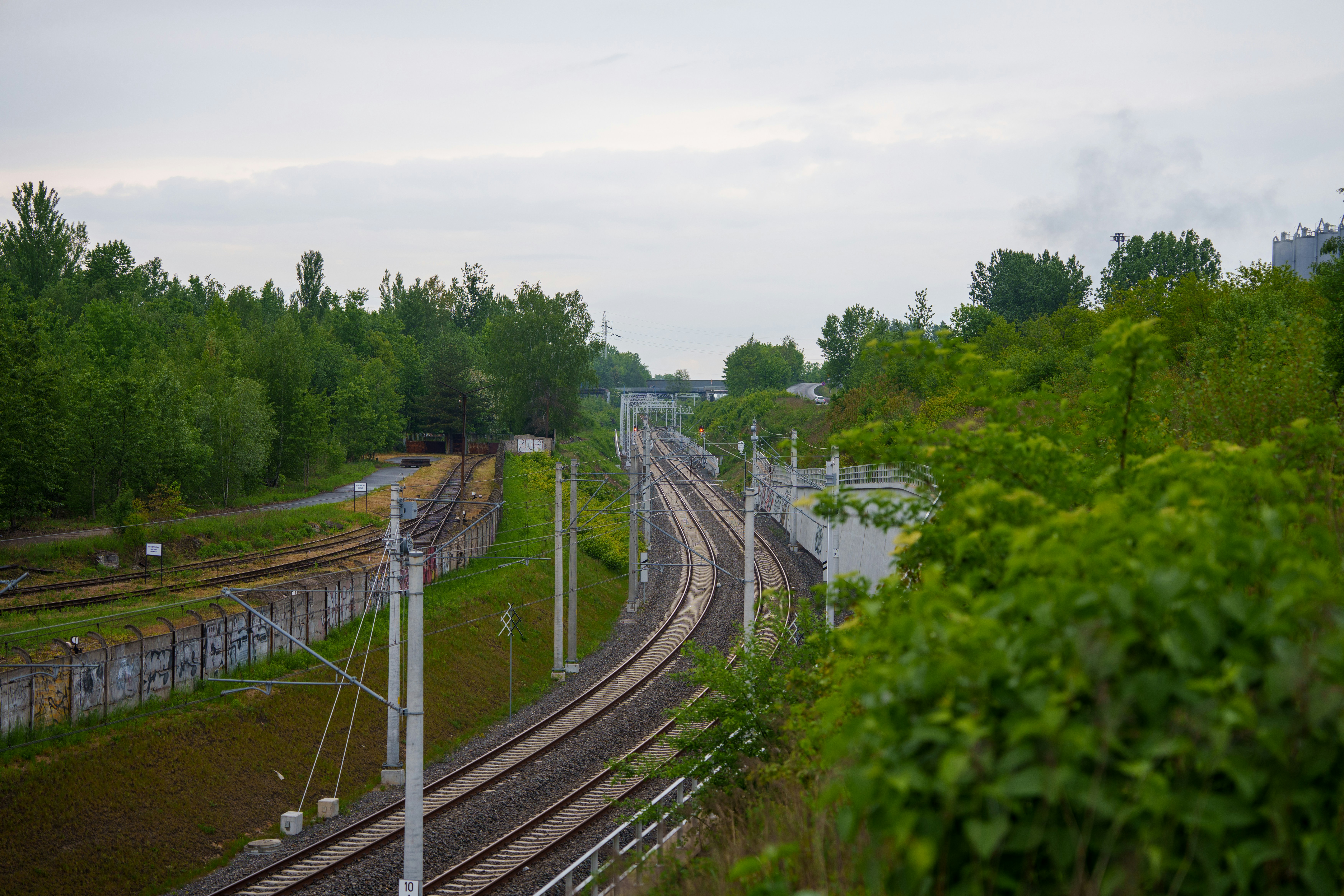 Railway Convergence: Rails Tunnel Through a Green Corridor