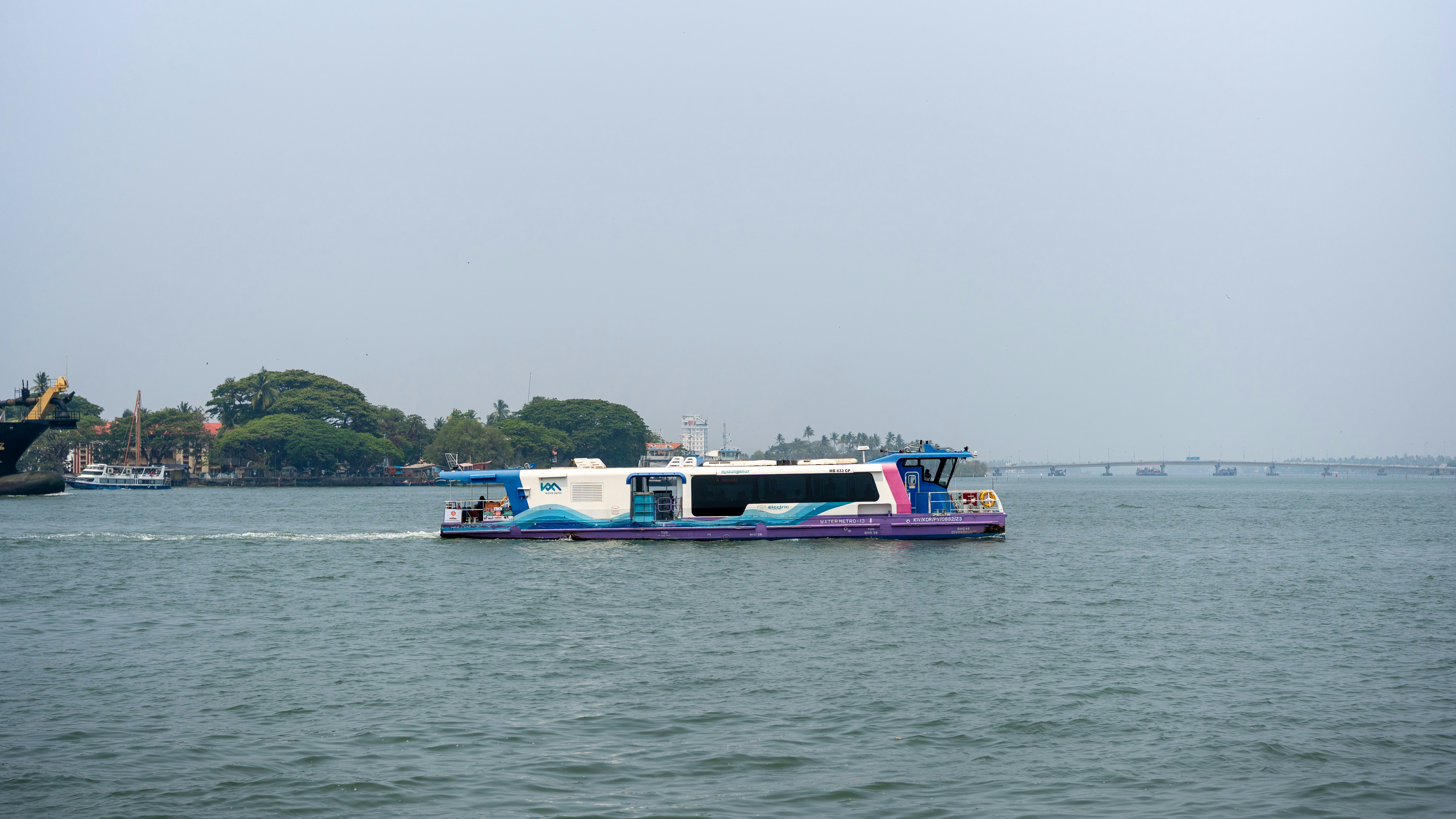 Colorful ferry gliding across a calm bay