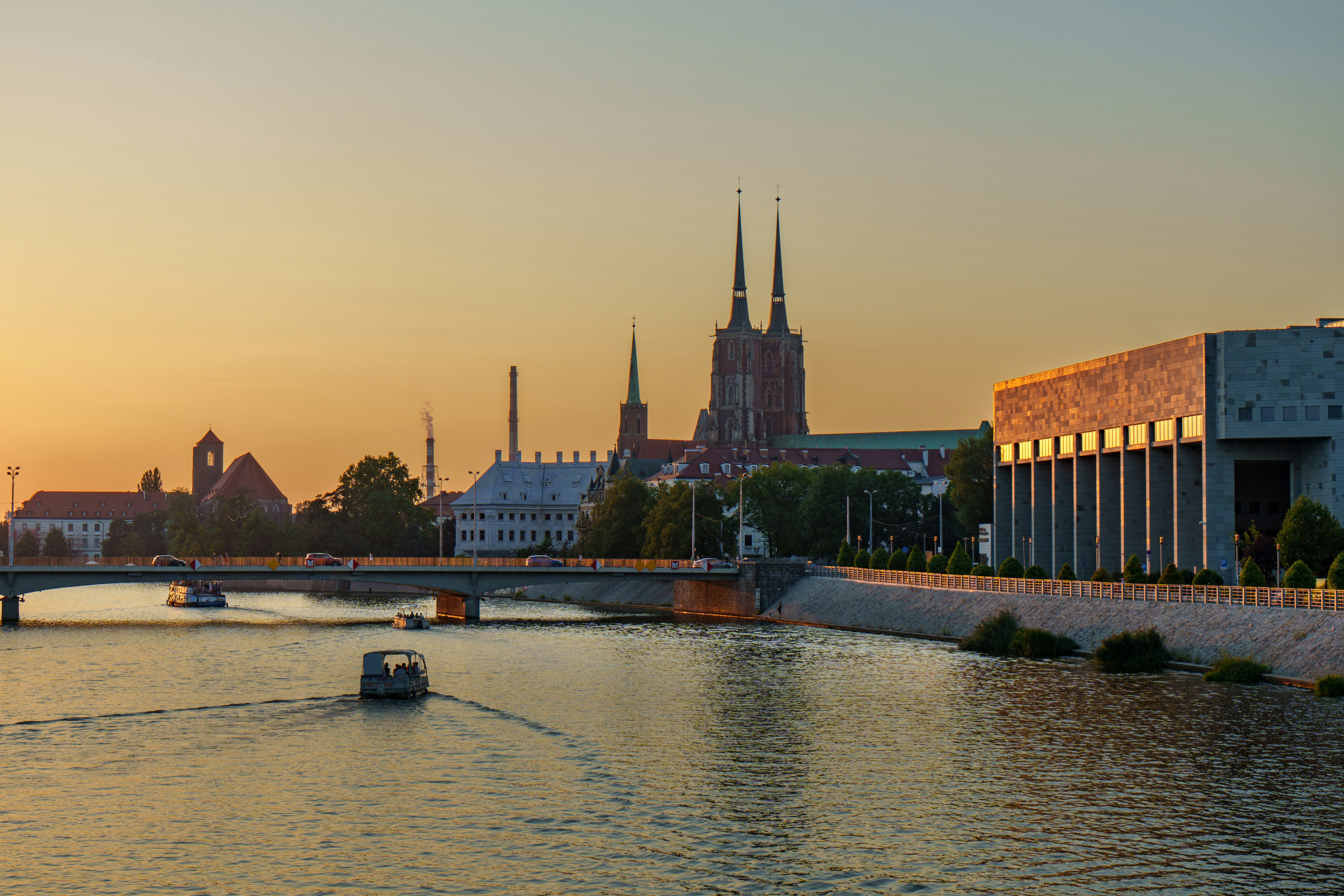 Evening Light Over the River Bend with a Prominent Cathedral Silhouette