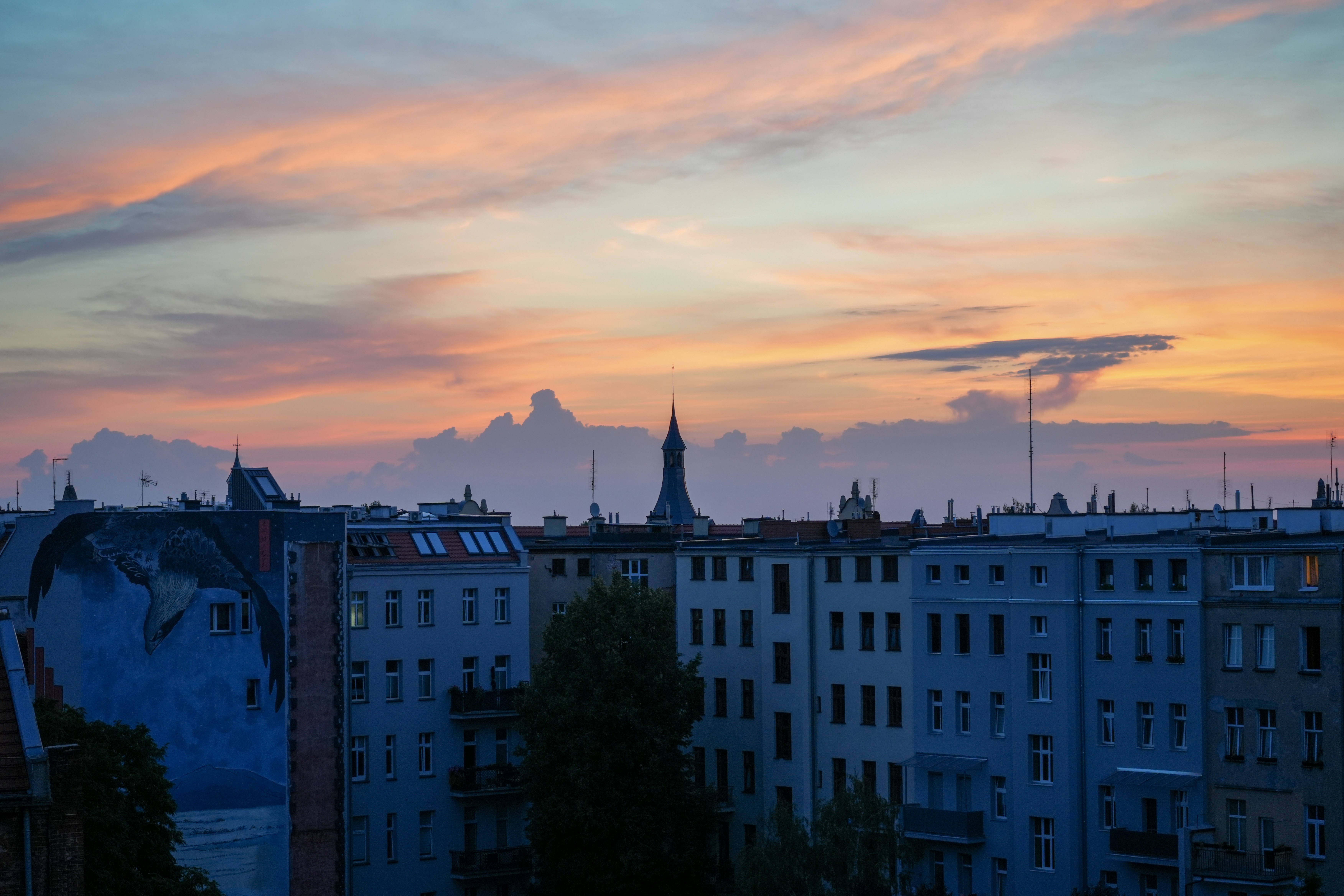 Sunset Over the Urban Ridge: A Quiet Rooftop Silhouette