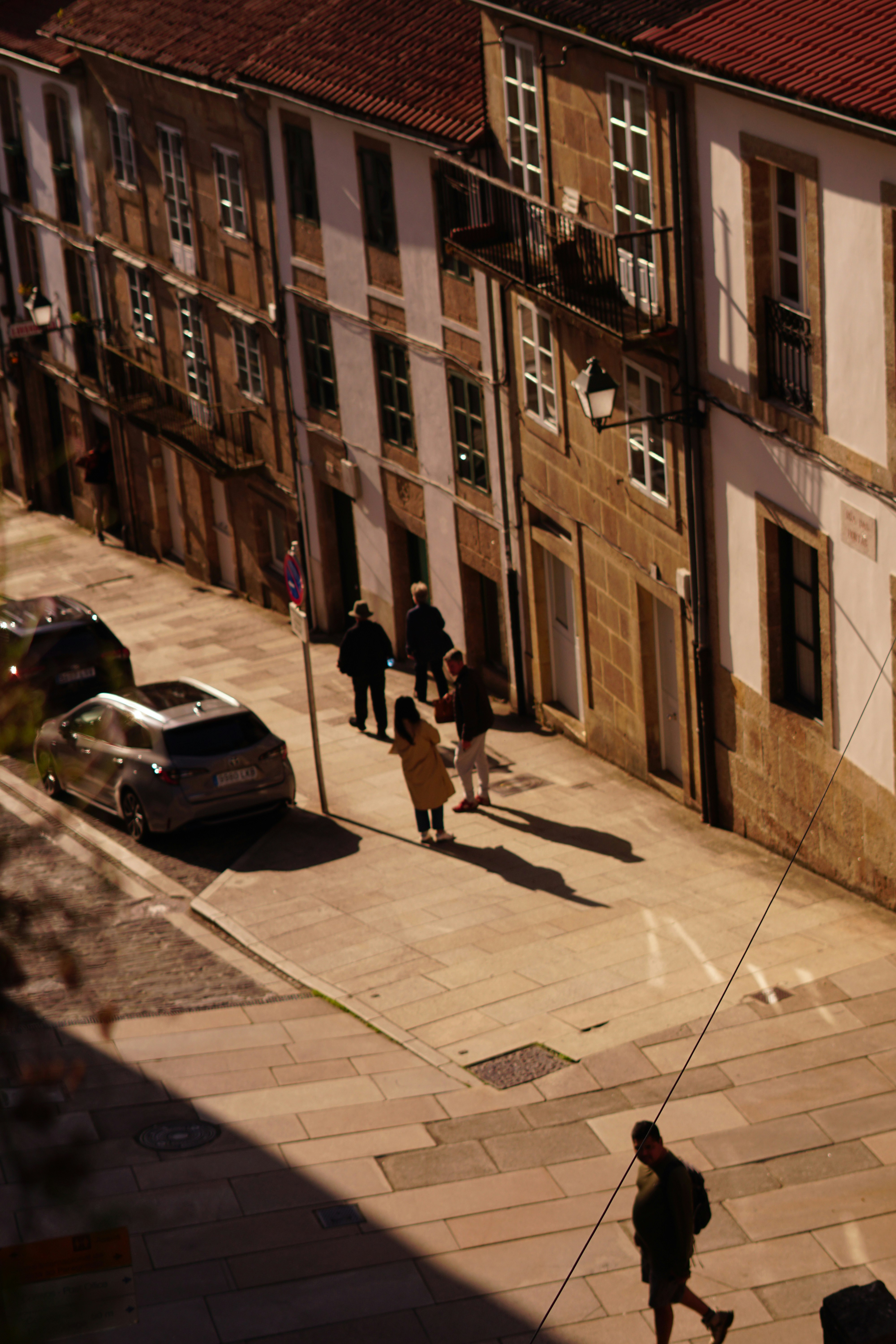 Sunlit Steps: A Quiet Gathering Beneath City Facades