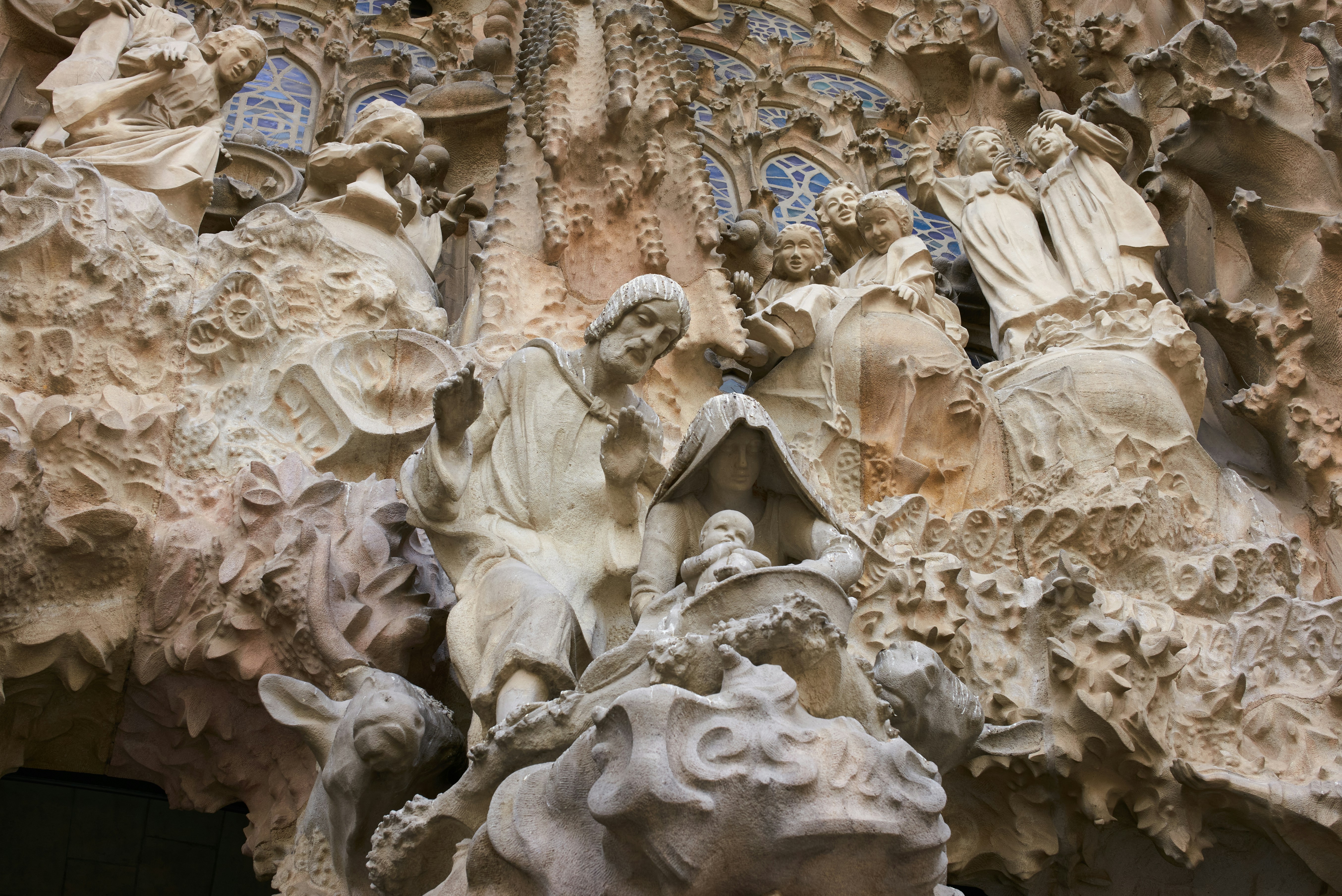 Stone Gathering: A Cathedral of Carved Figures Reaching Toward Light
