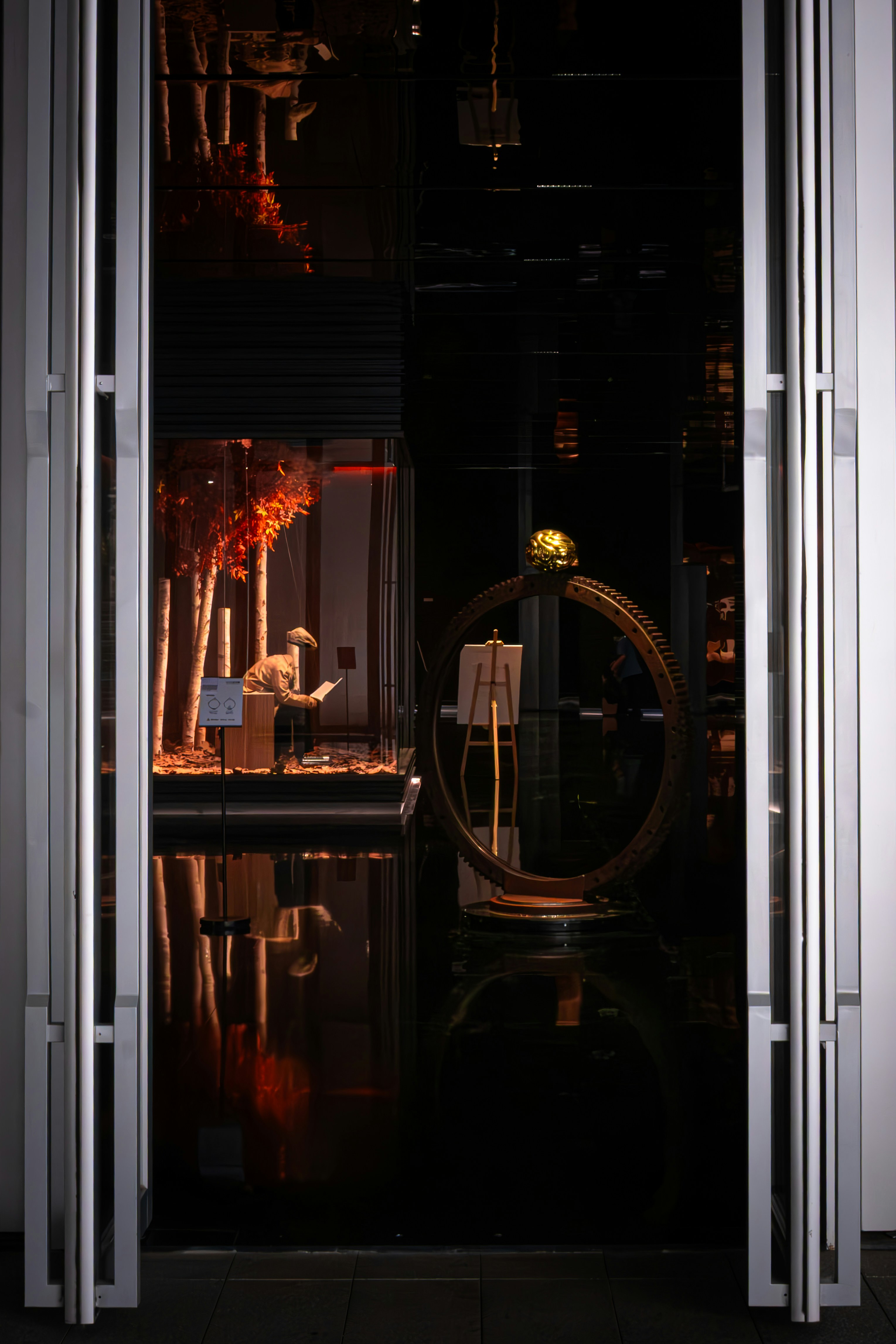 Circular Frame of Nightwalkers inside a Glass Corridor