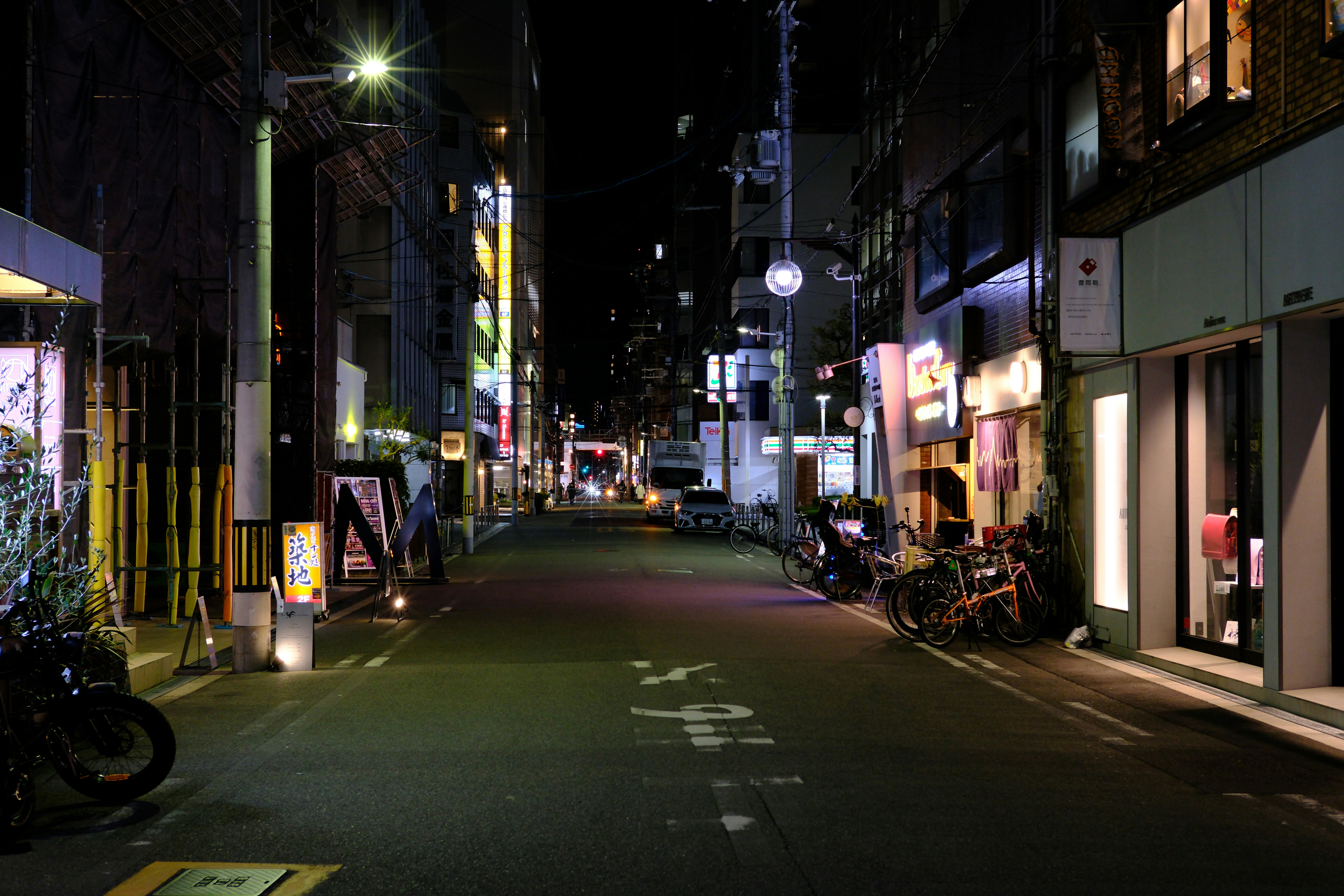Neon Alleyway: Nightlife in a Quiet Urban Corridor
