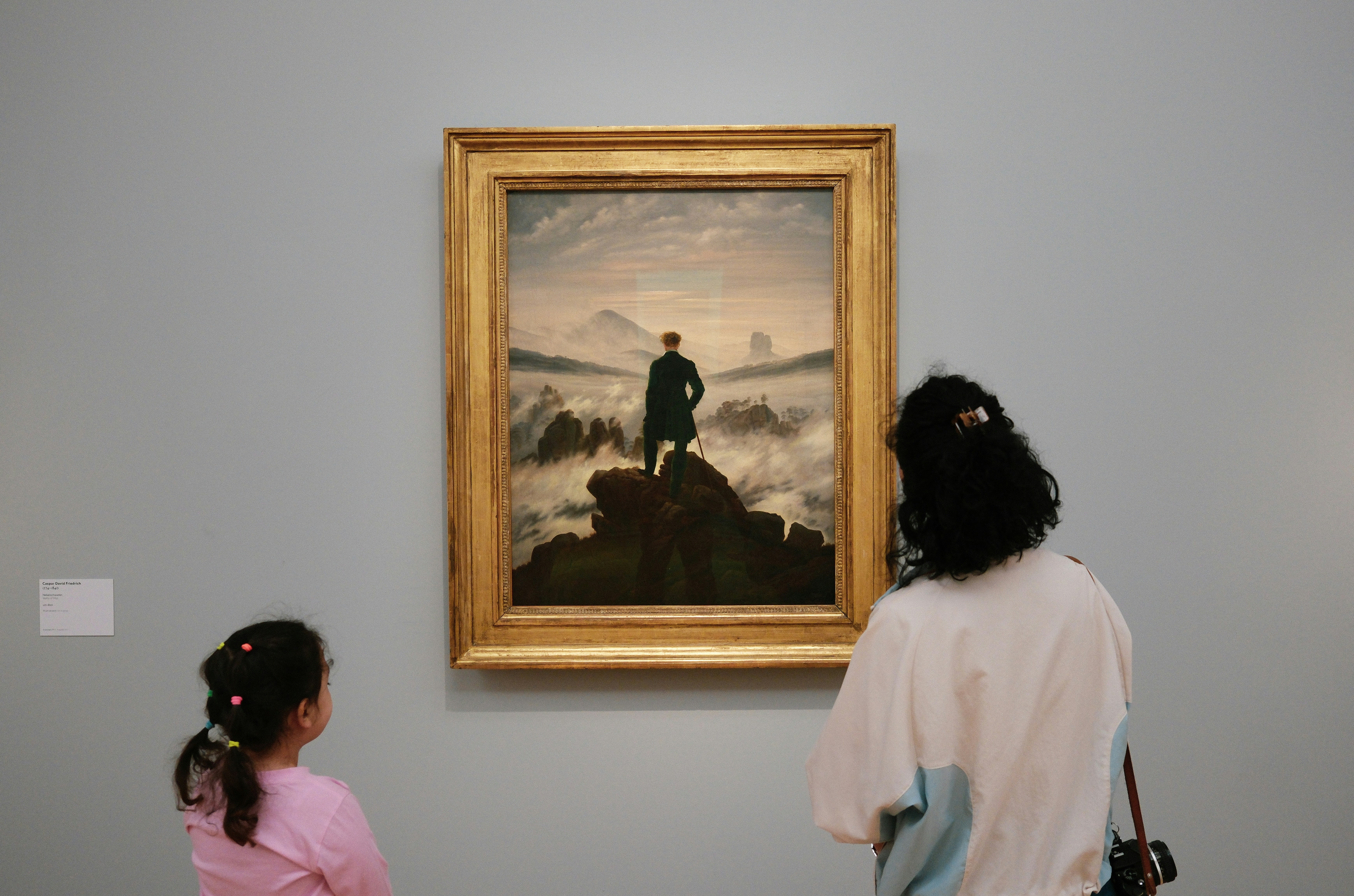 Portrait of a Silent Gaze: Viewers Stand Before a Climbed Figure