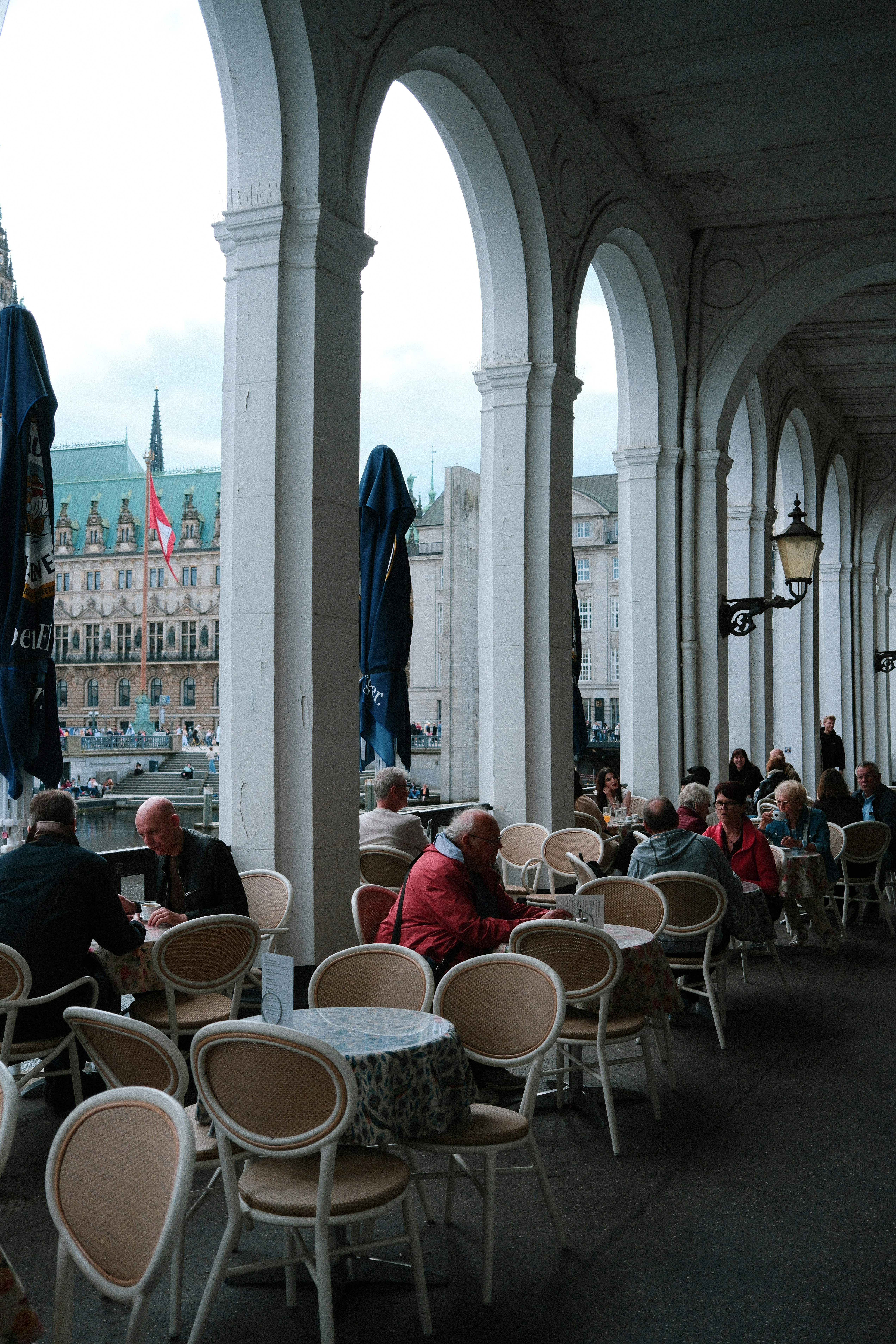Arcade Terrace: Café under White Colonnades Overlooking the City Harbor