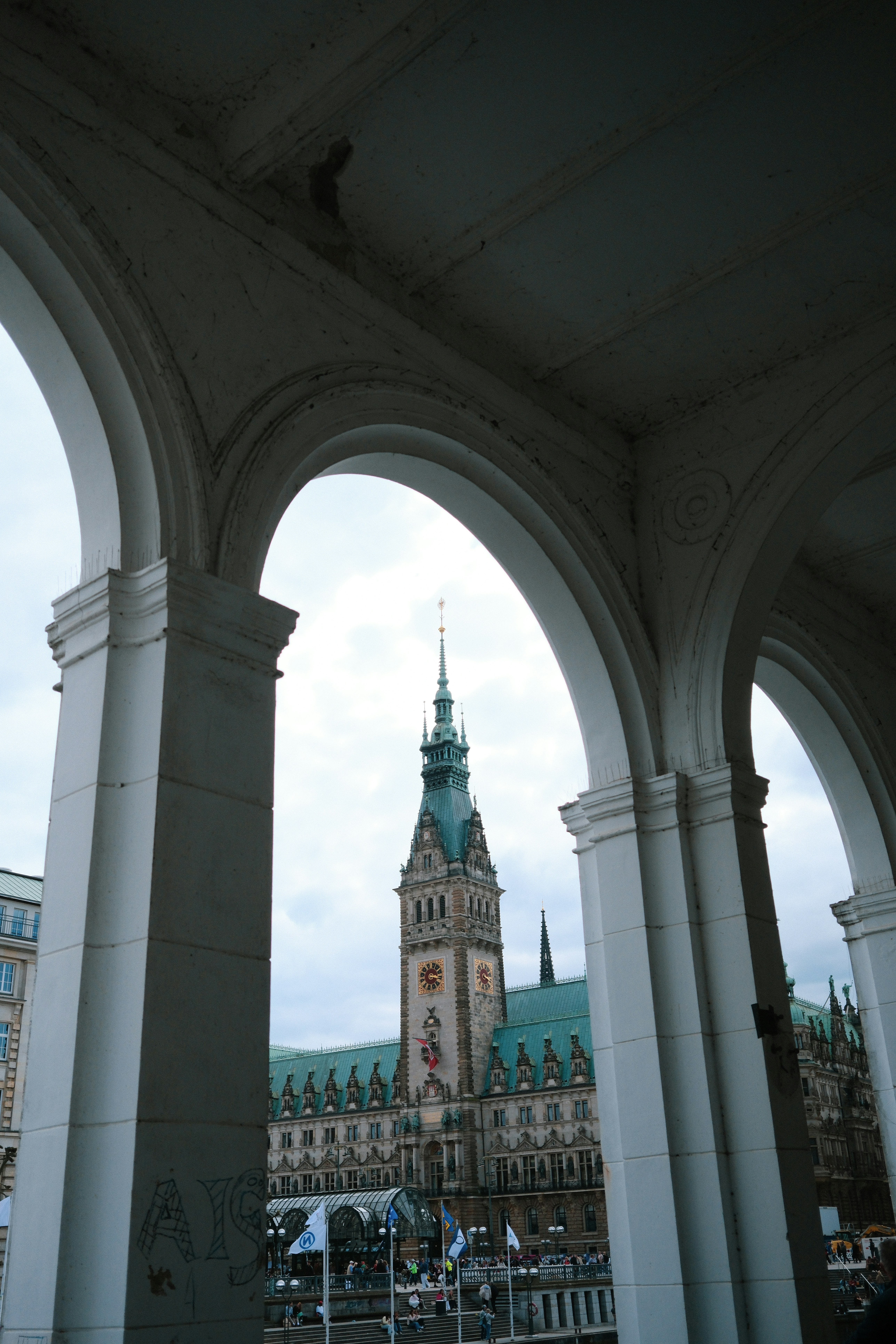 Archway Framing: City Hall Spire Surging Through Classical Arches