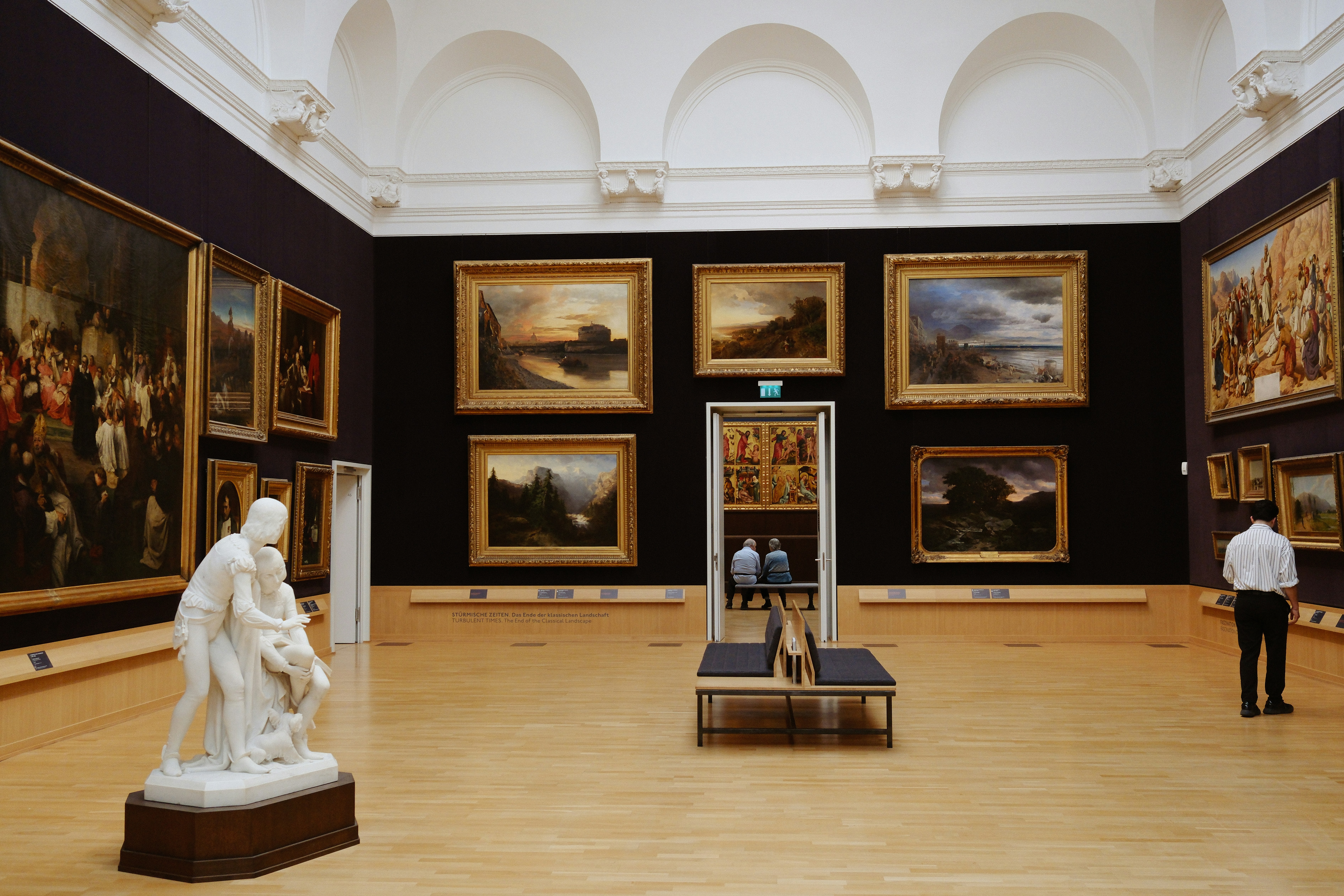 Quiet Gallery Corridor: Portraits and Promenade