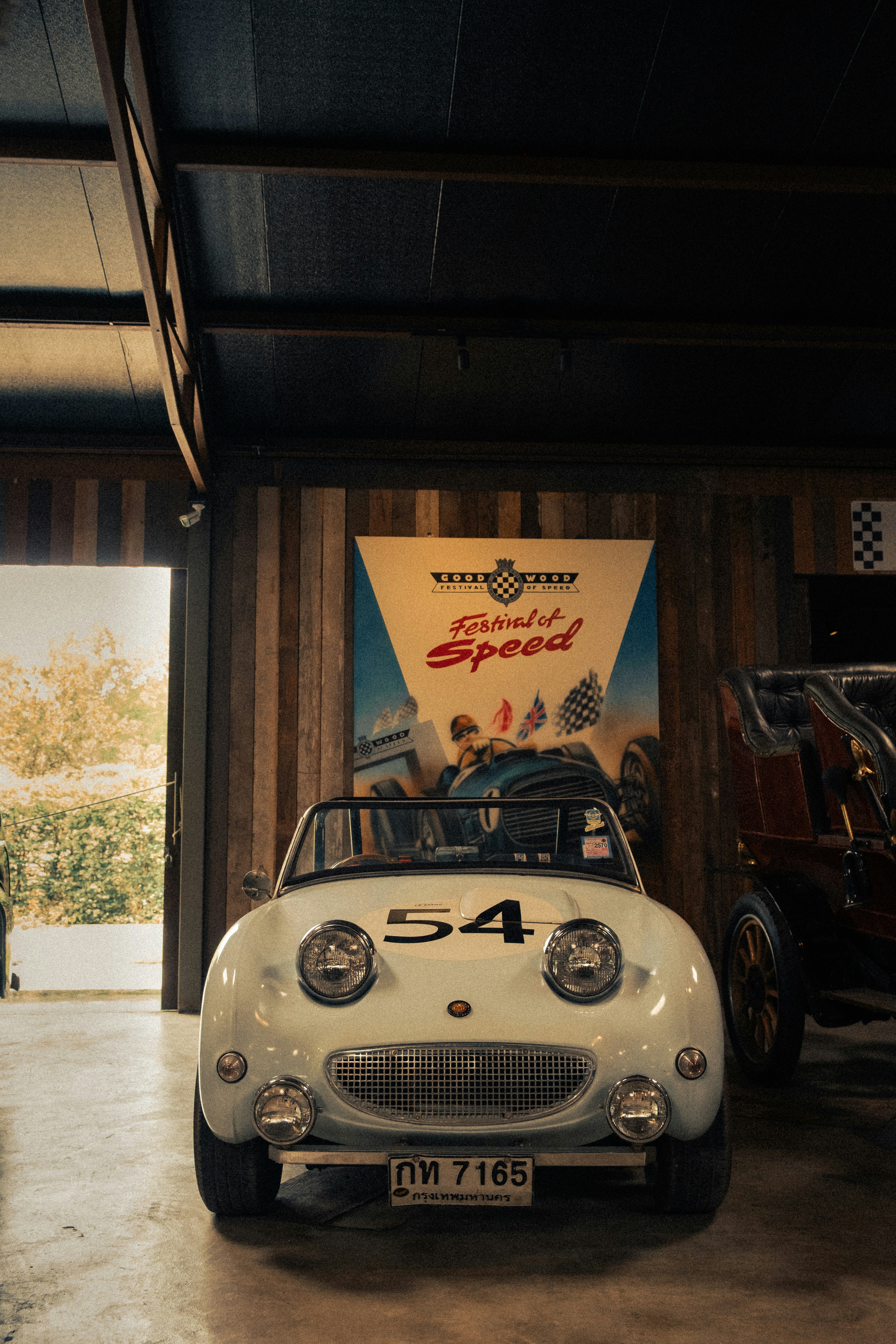 Vintage Racecar Resting in a Dim Gallery