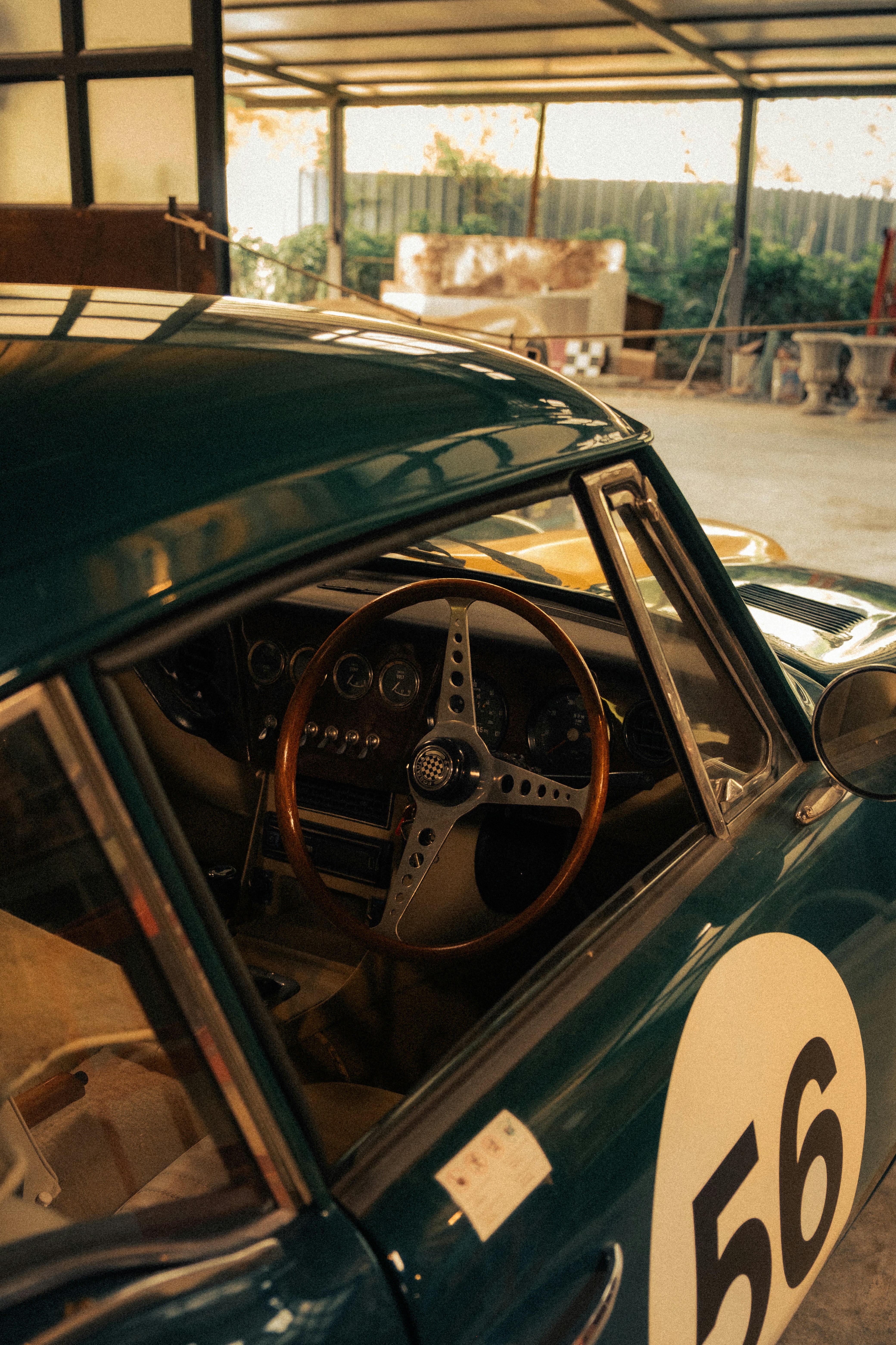 Cockpit of nostalgia: vintage race car through the windshield opening
