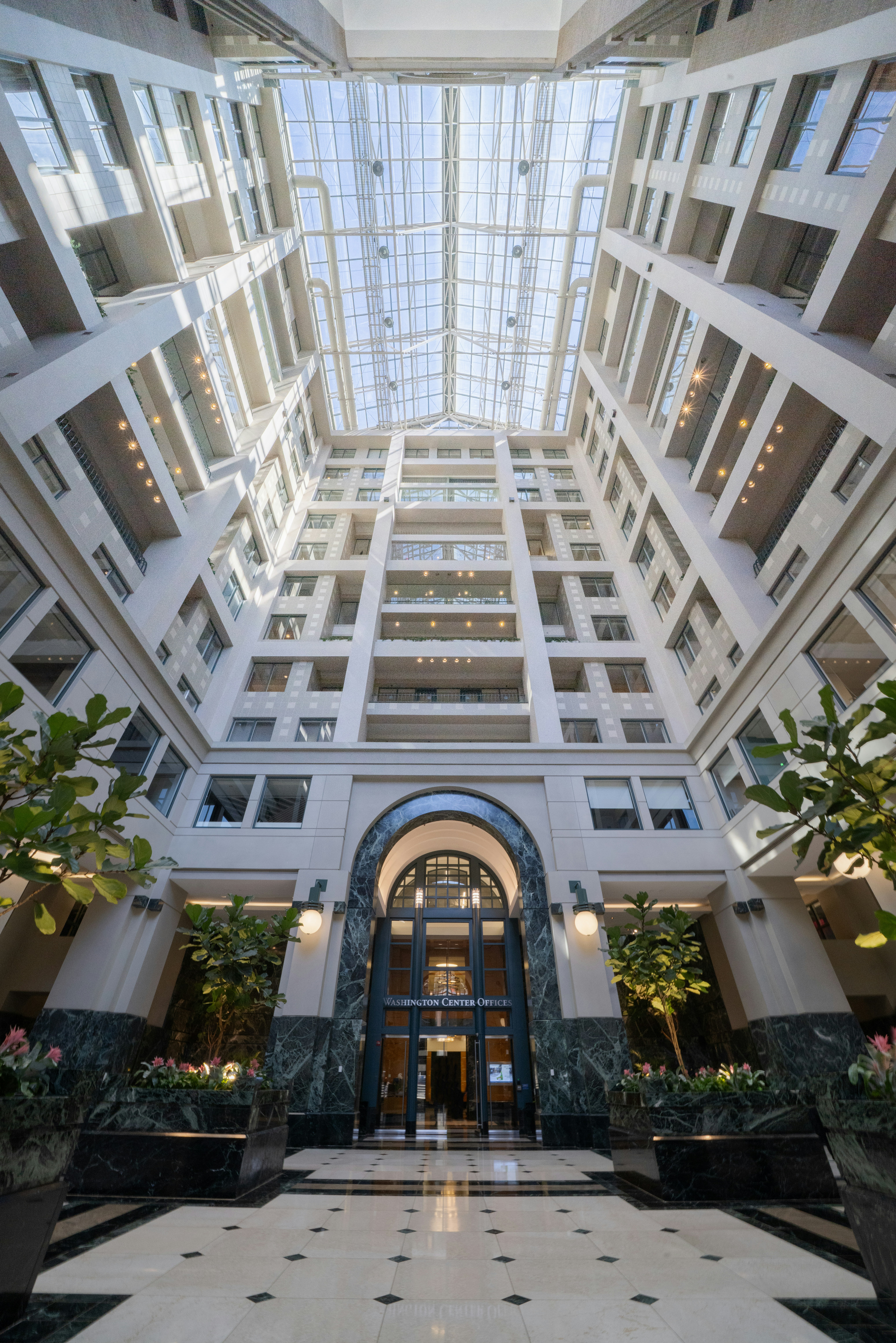 Atrium Ascendant: Glass Roof and Marble Archway