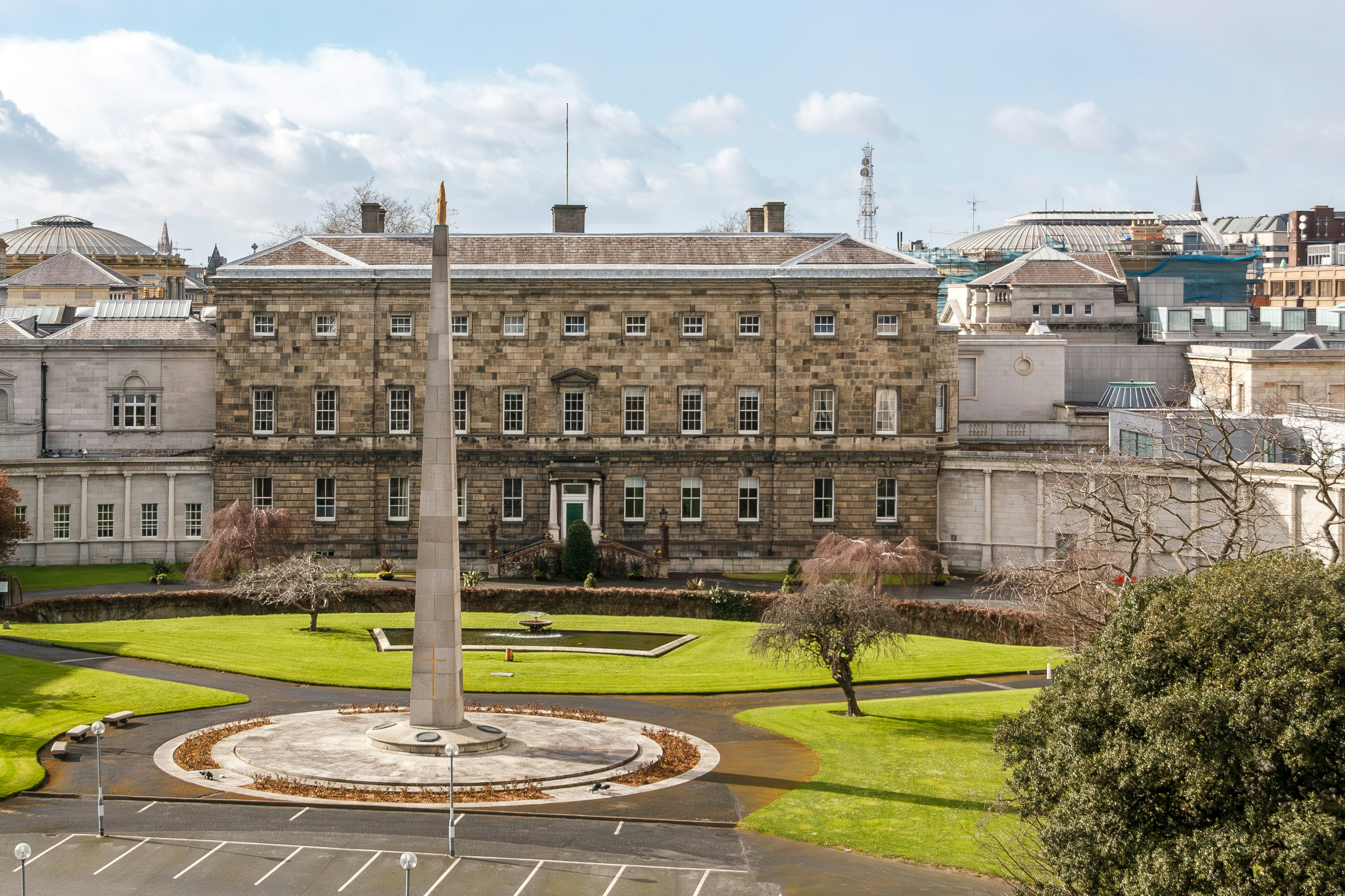 Obelisk Gateway: A City Park Framed by Historic Facades