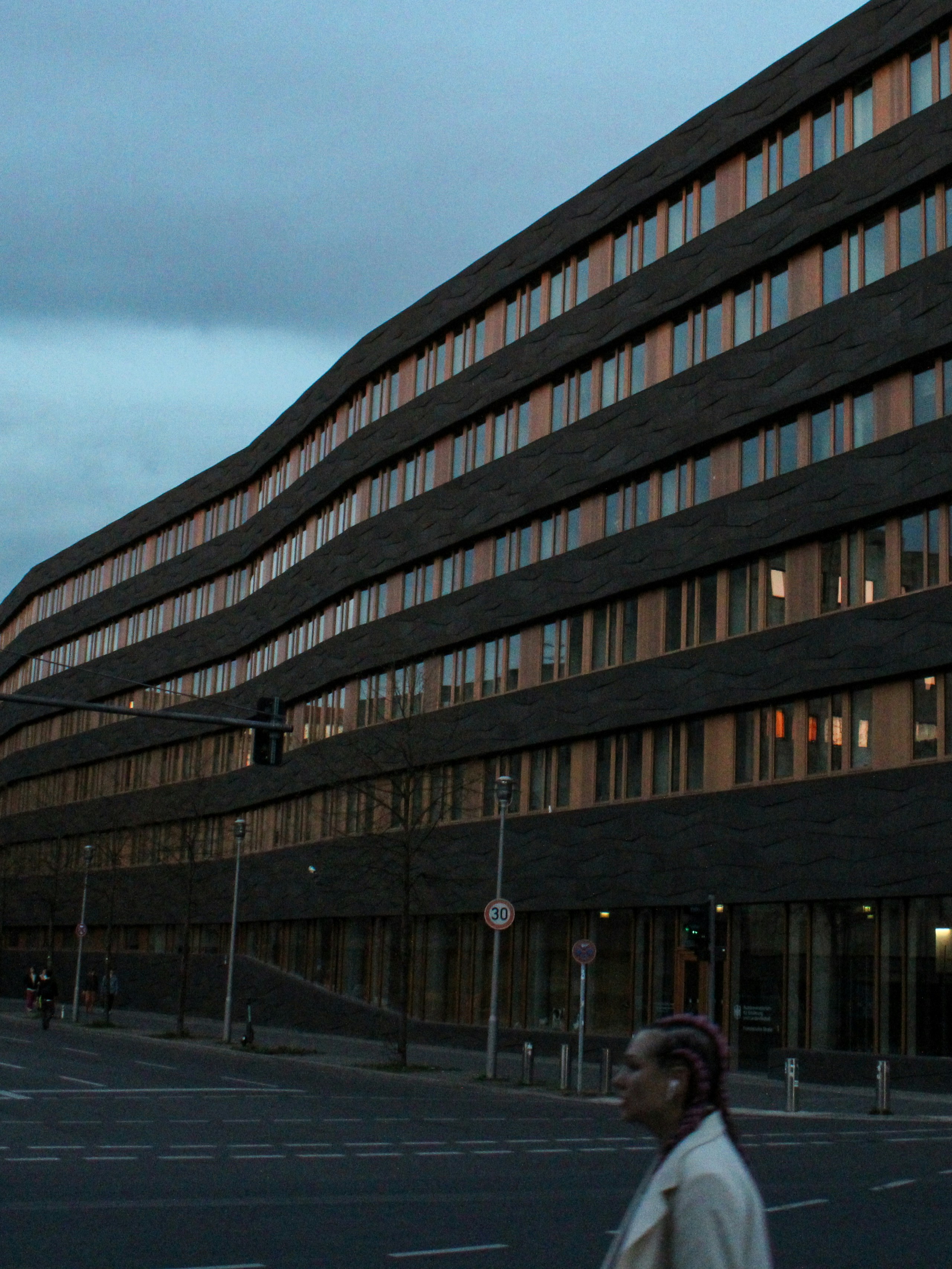 Urban Lines: The Diagonal Facade and a Passing Figure
